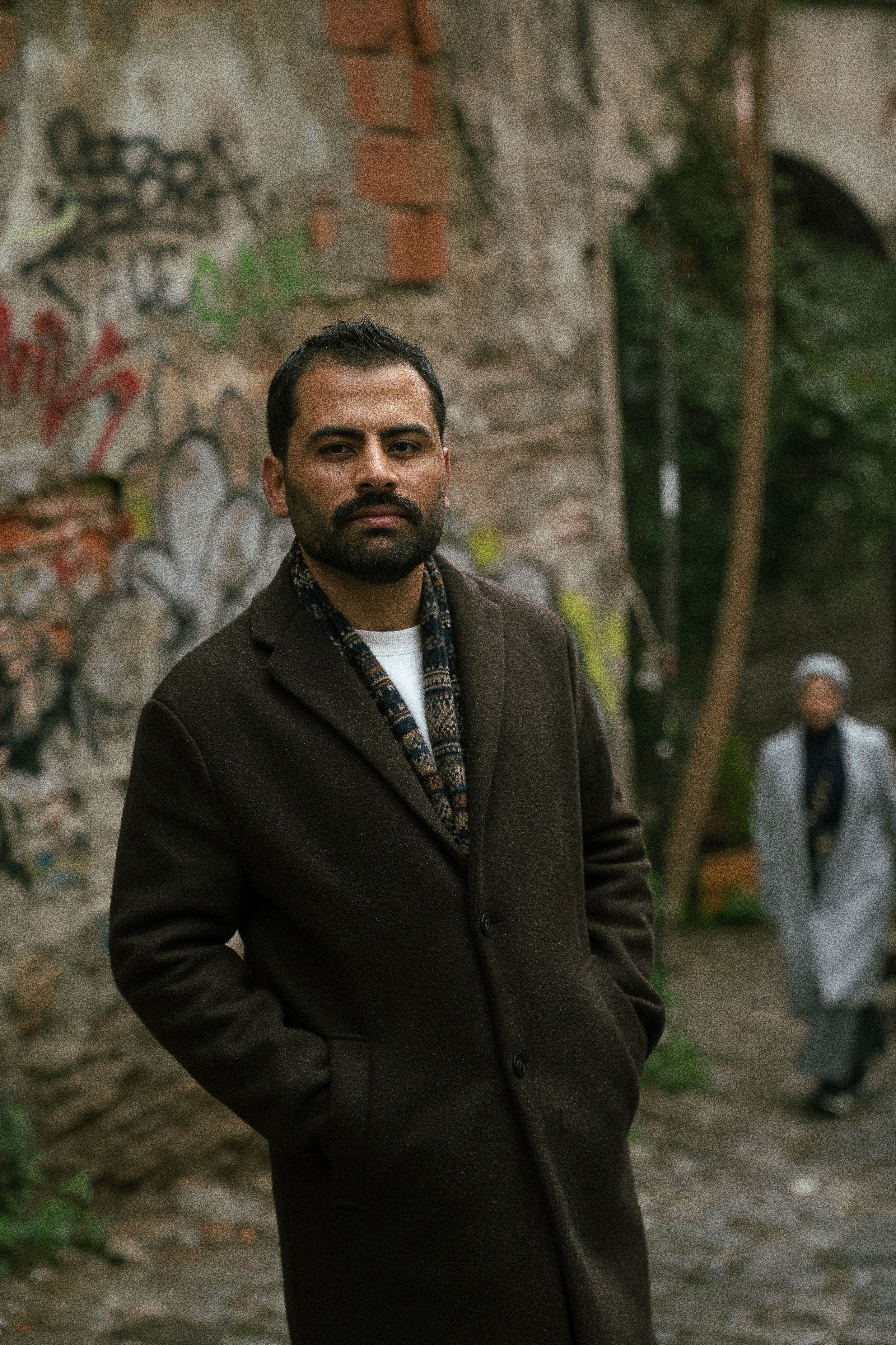 Man in Brown Coat on Urban Street · Free Stock Photo