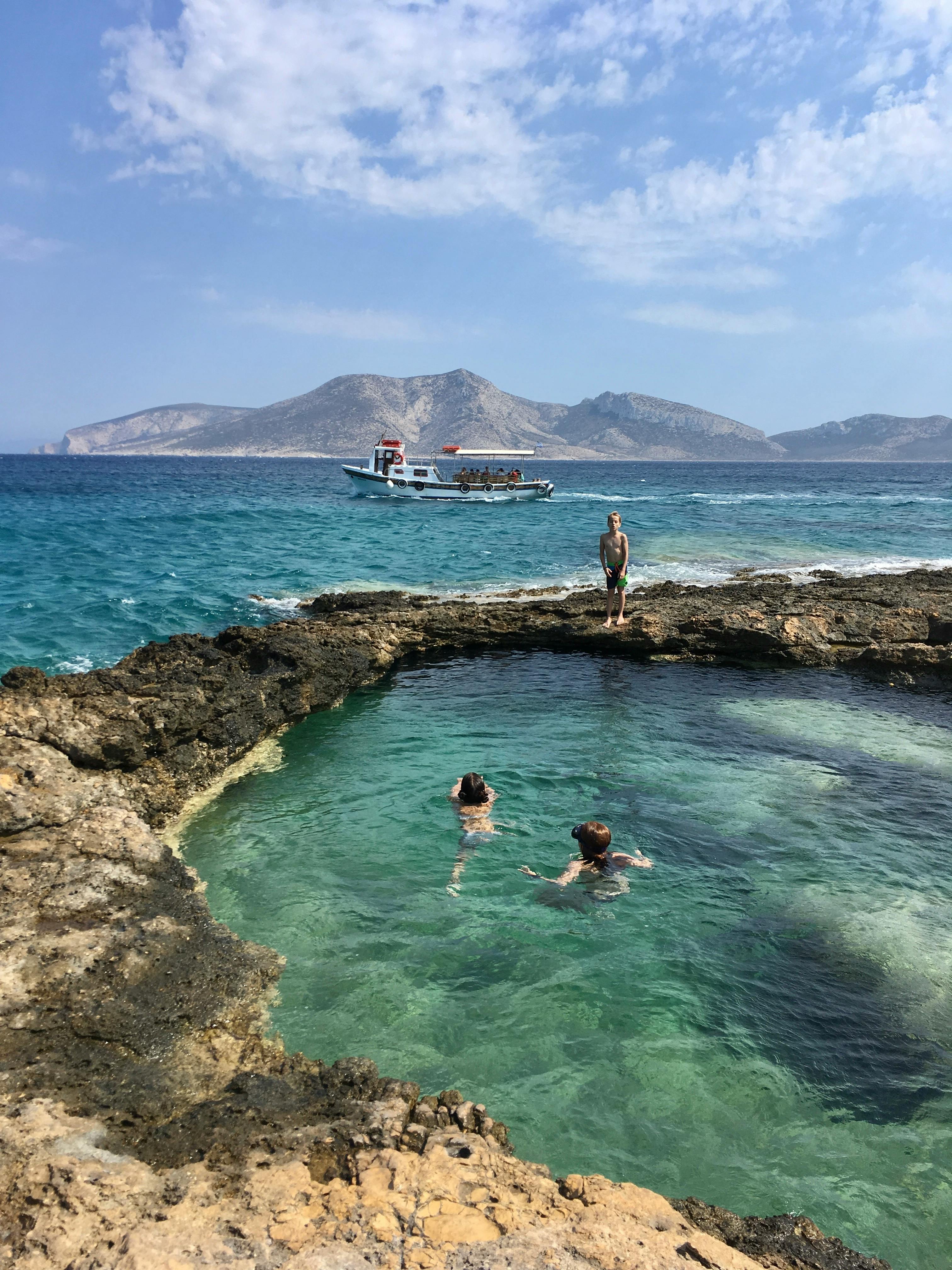 People Enjoying Natural Sea Pool by Rocky Coastline · Free Stock Photo