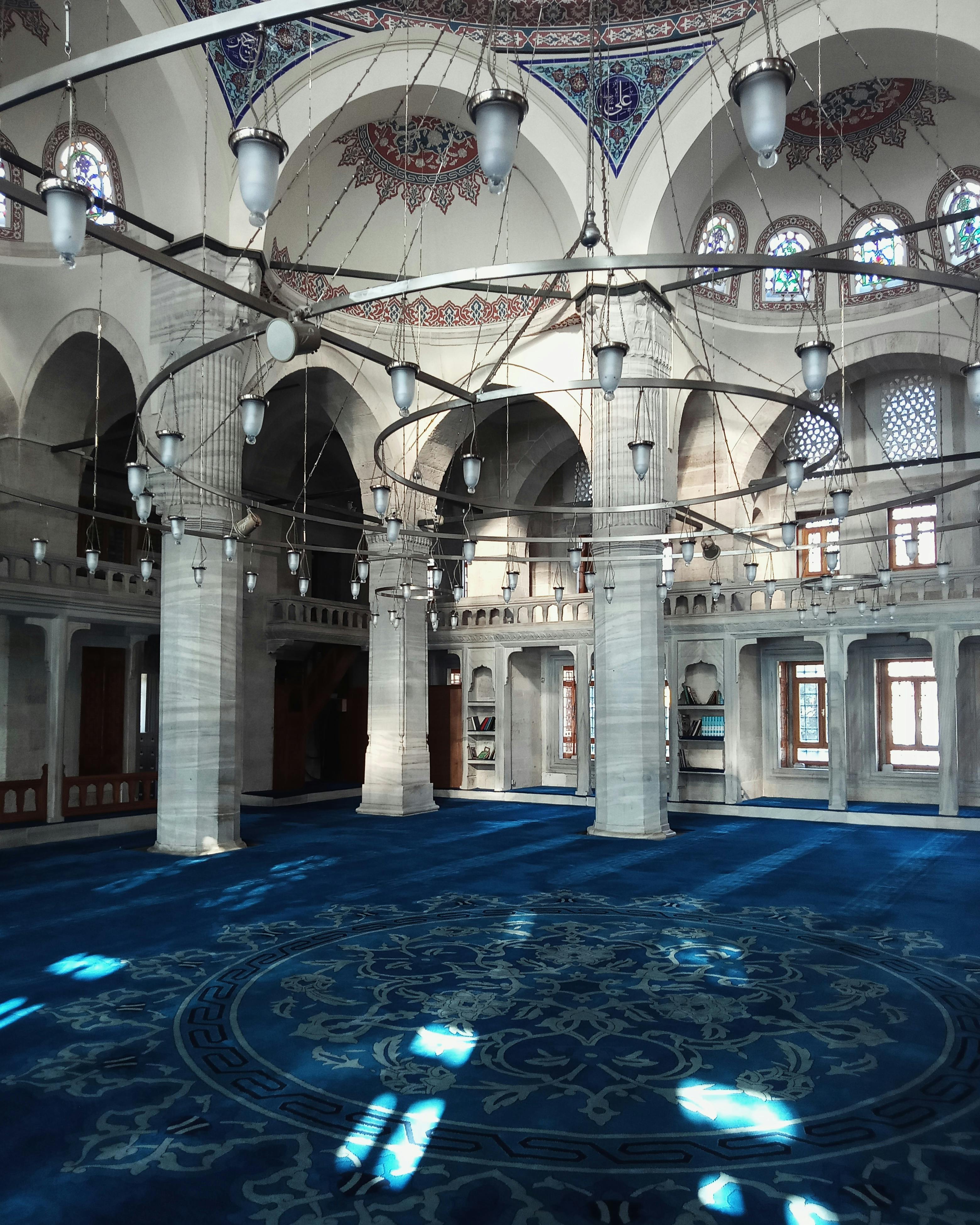 Intricate Mosque Interior with Blue Carpet · Free Stock Photo