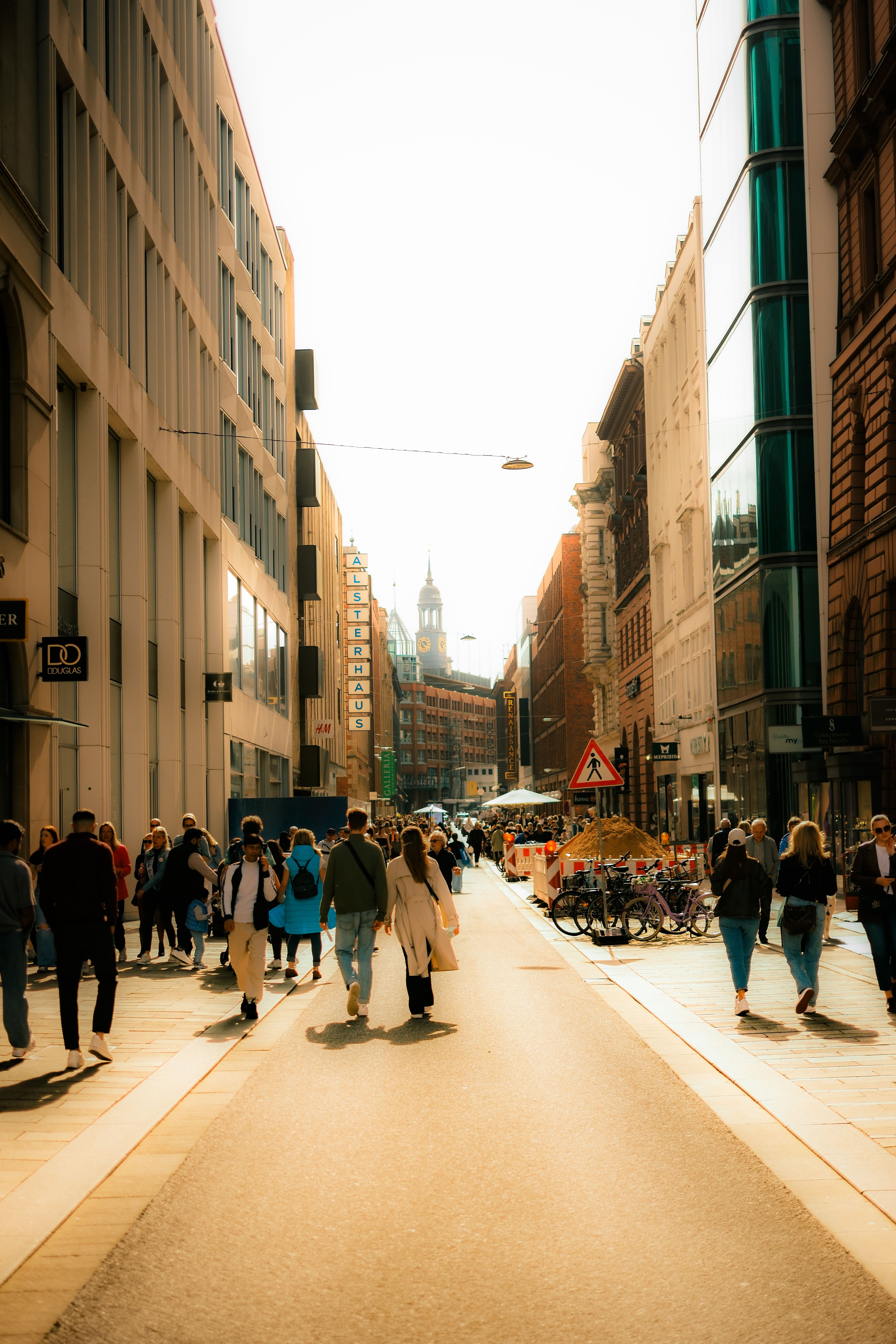 Busy Urban Street Scene with Pedestrians and Bicycles · Free Stock Photo
