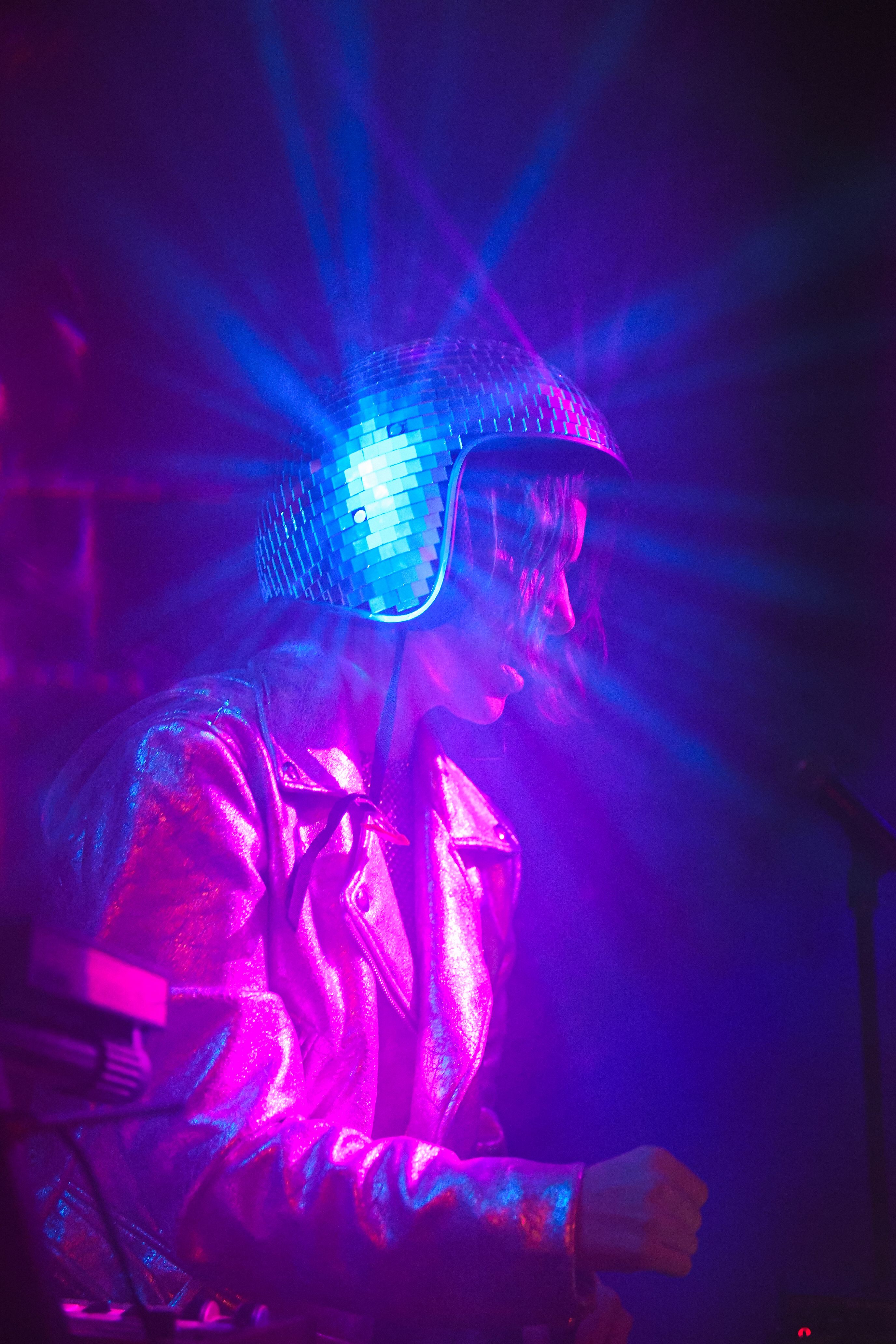 Disco DJ in Vibrant Neon Lights · Free Stock Photo