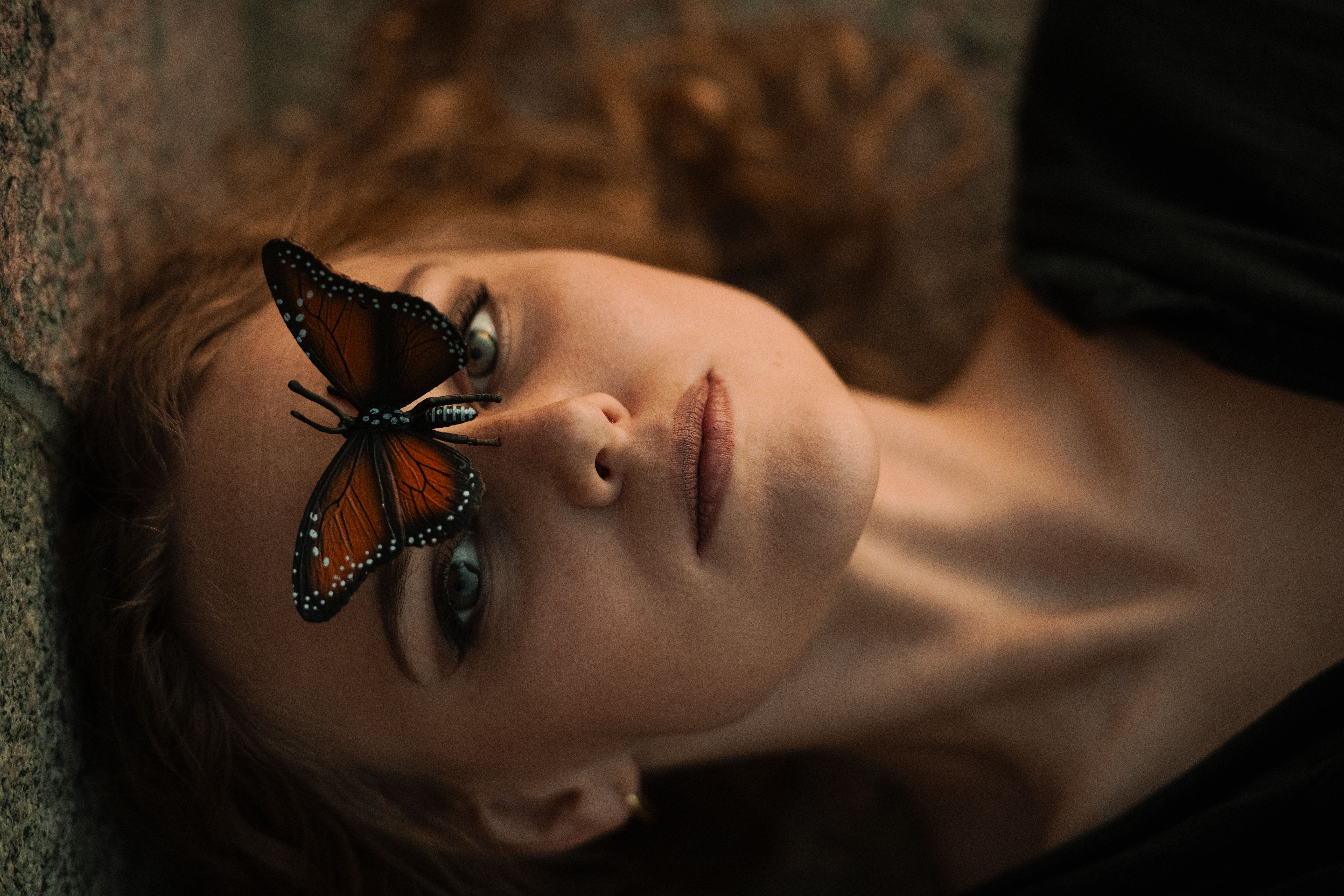 Close-Up Portrait of Woman with Monarch Butterfly · Free Stock Photo
