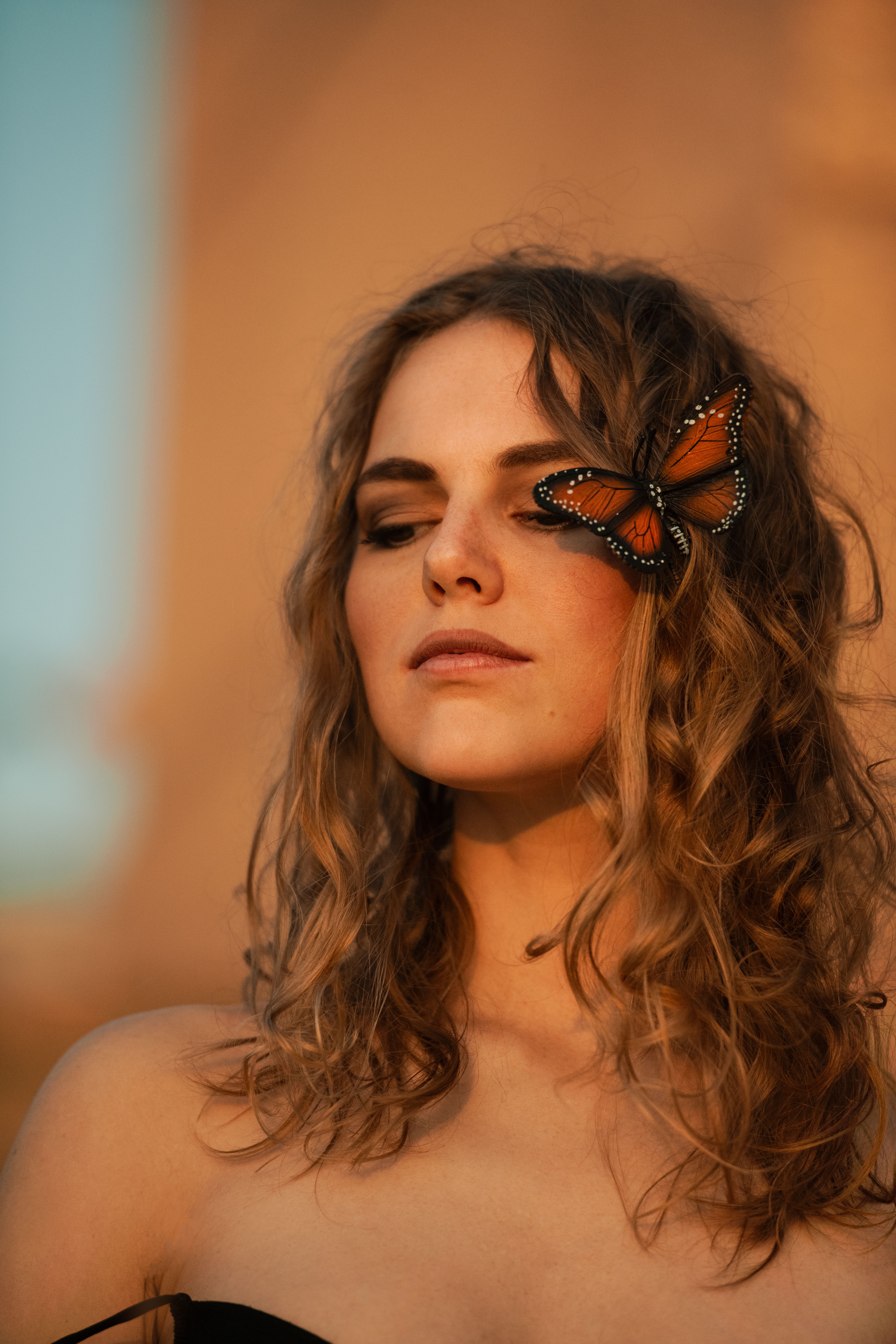 Elegant Portrait with Monarch Butterfly Accent · Free Stock Photo