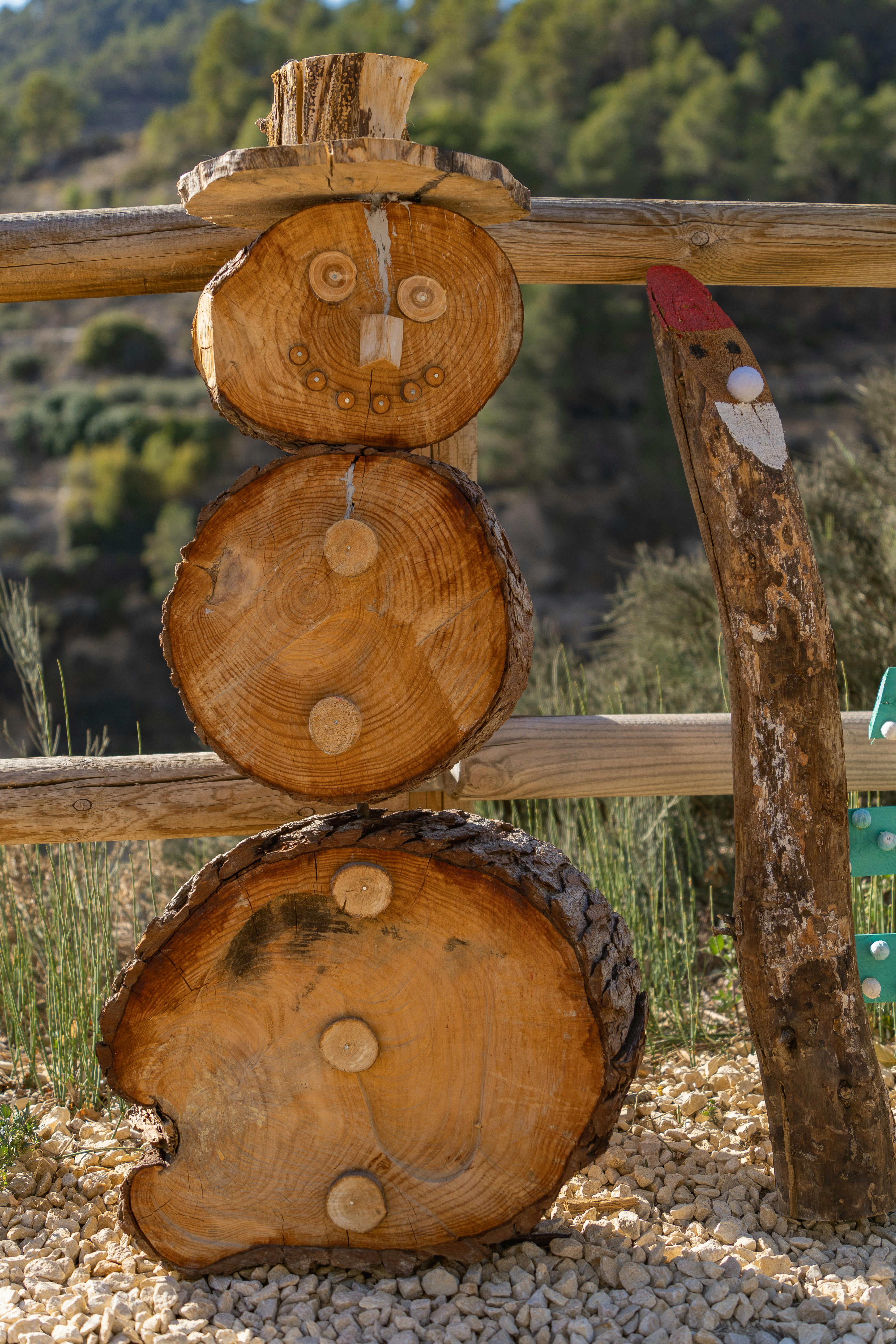 Rustic Wood Snowman Sculpture Outdoors · Free Stock Photo