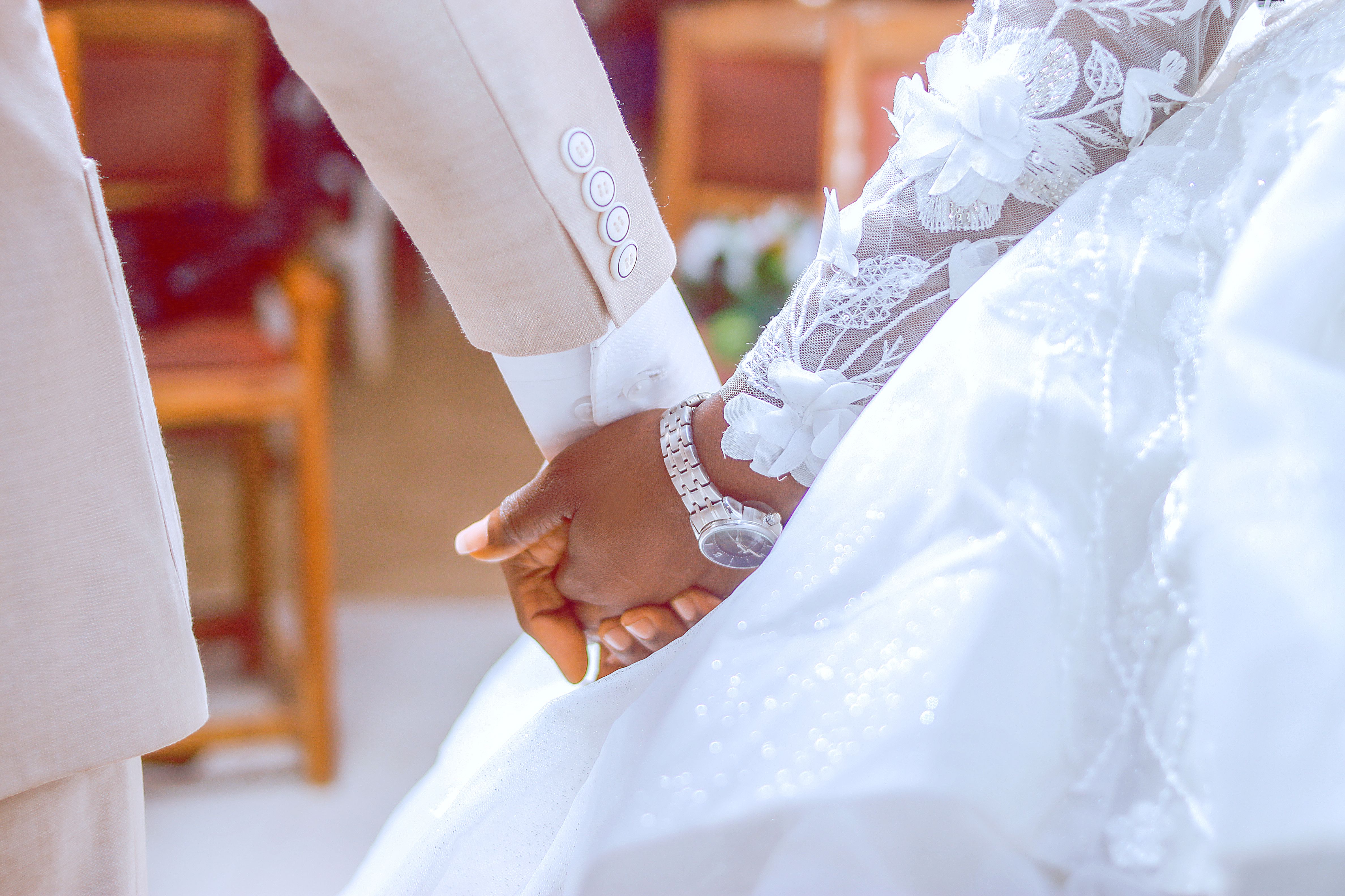 Elegant Wedding Couple Holding Hands Close-Up · Free Stock Photo