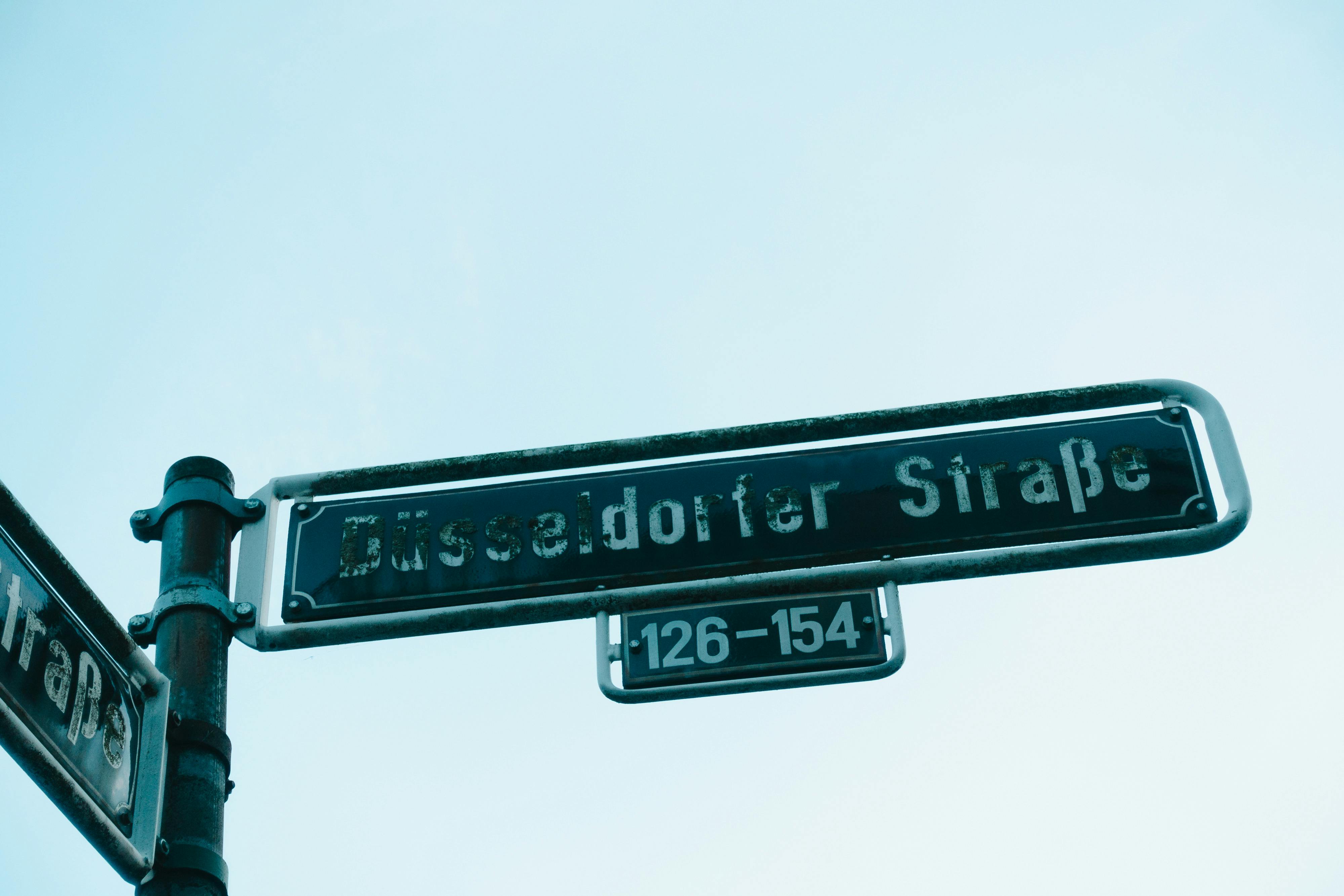 Street Sign in Düsseldorf Cityscape · Free Stock Photo
