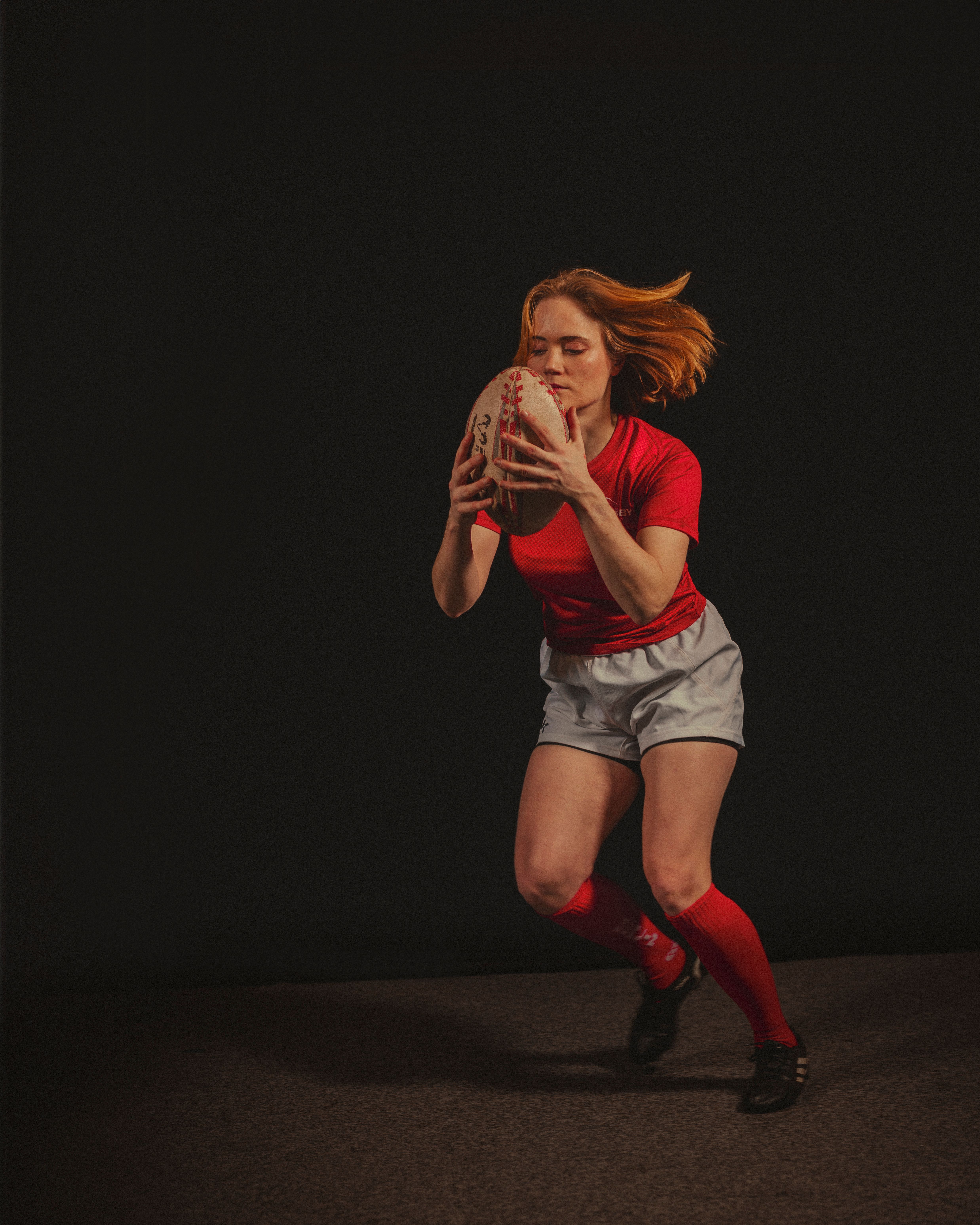 Dynamic Studio Portrait of Female Rugby Player · Free Stock Photo