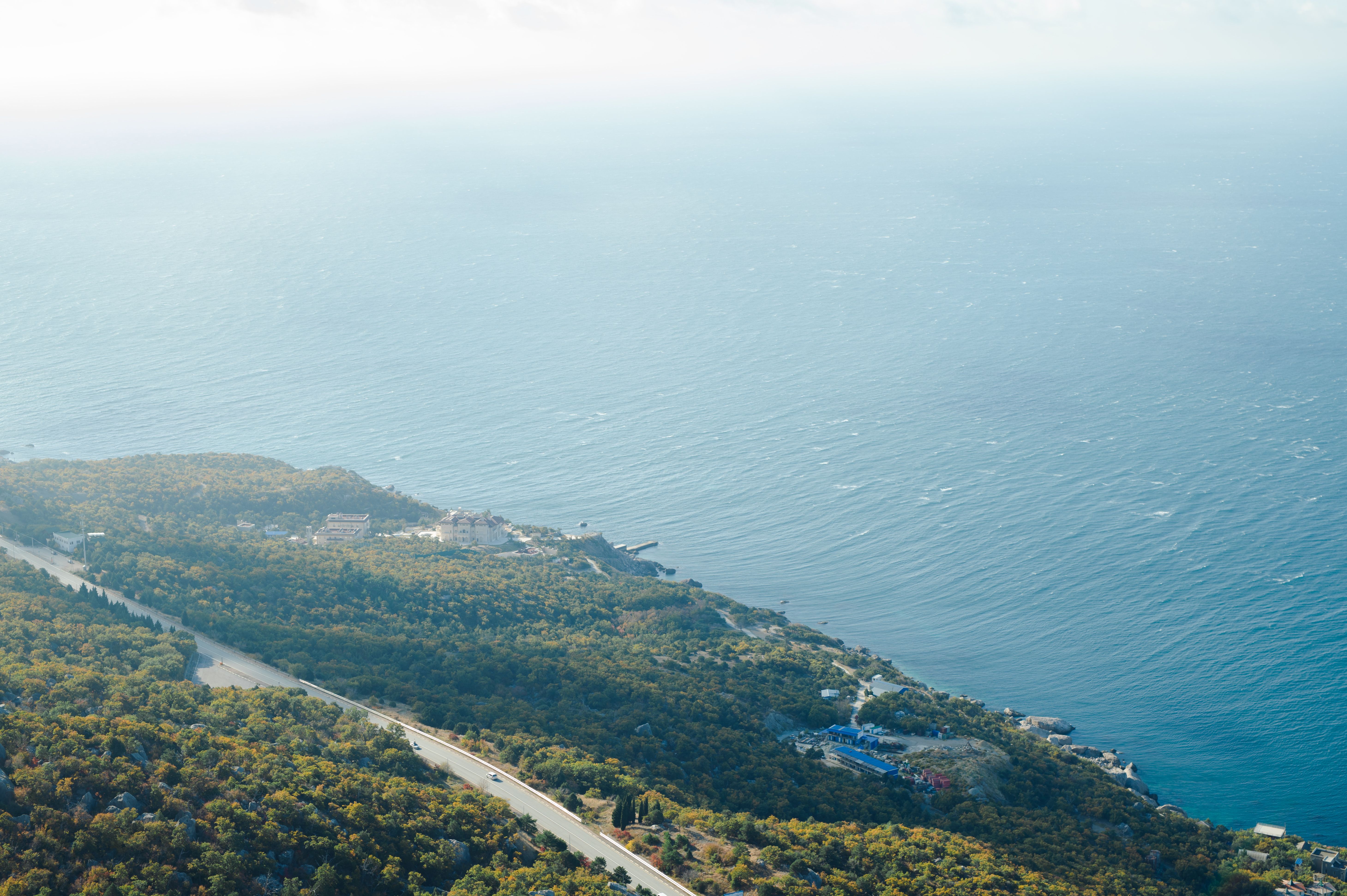Aerial View of Coastal Landscape and Blue Sea · Free Stock Photo