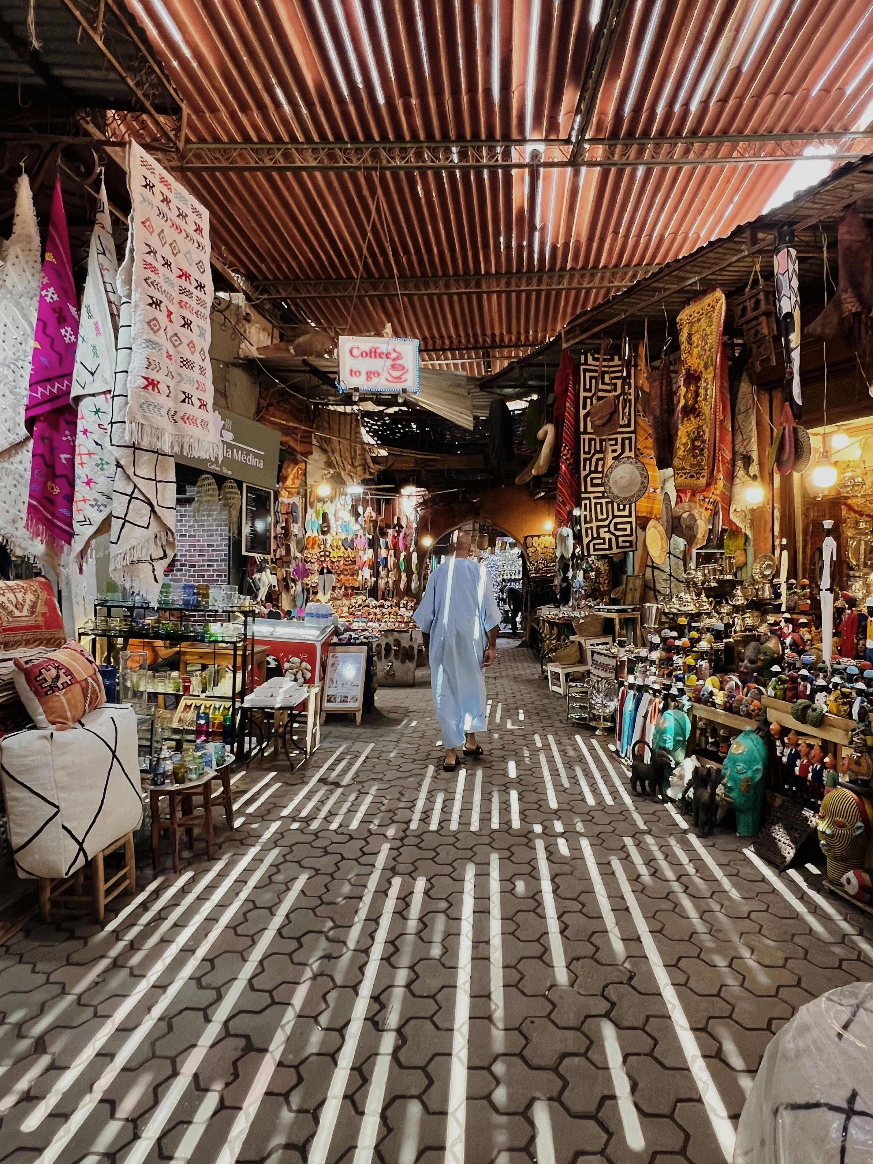 Bustling Souk with Traditional Moroccan Textiles · Free Stock Photo