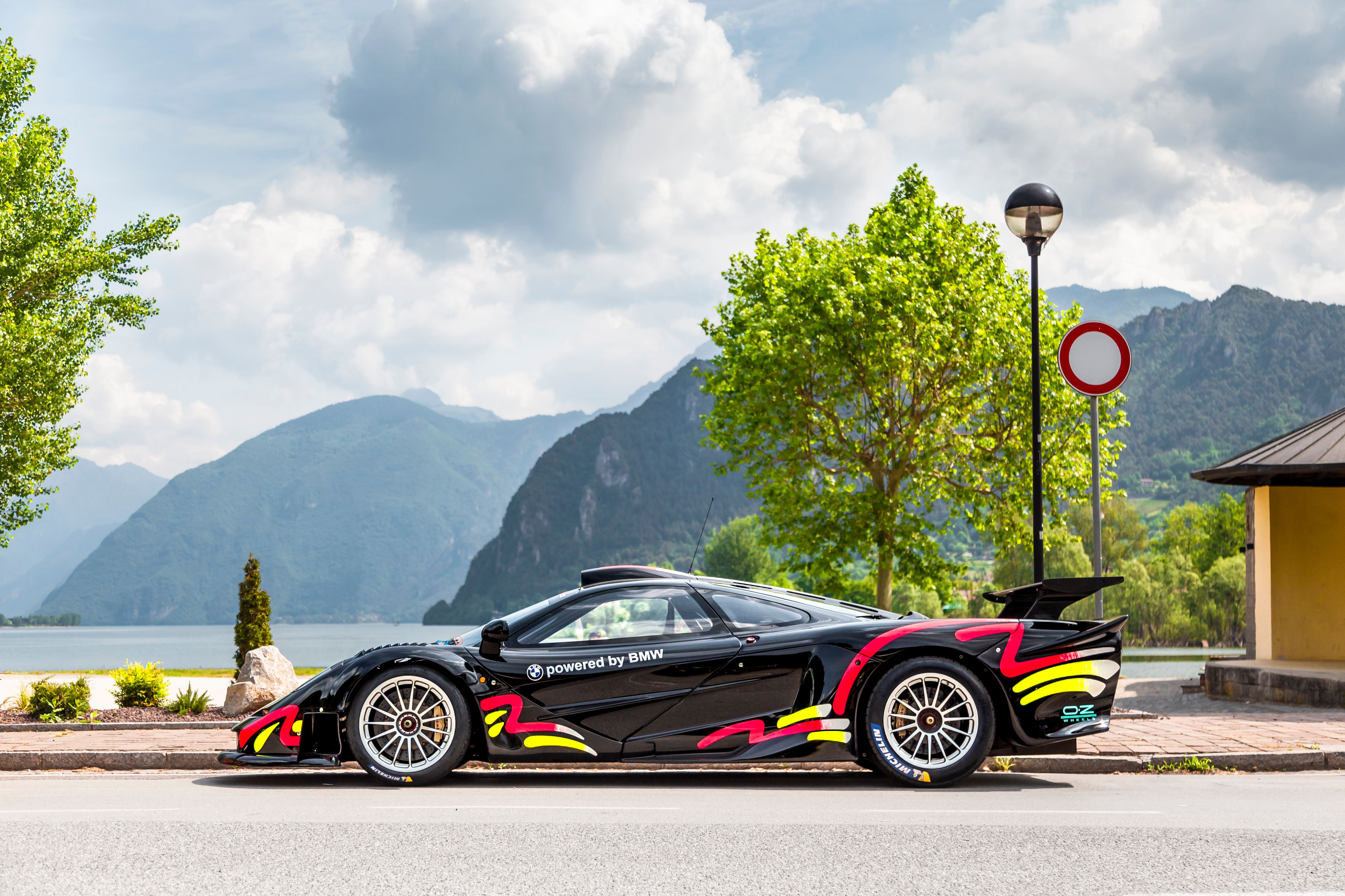 Vibrant Supercar by Scenic Lakeside Road · Free Stock Photo