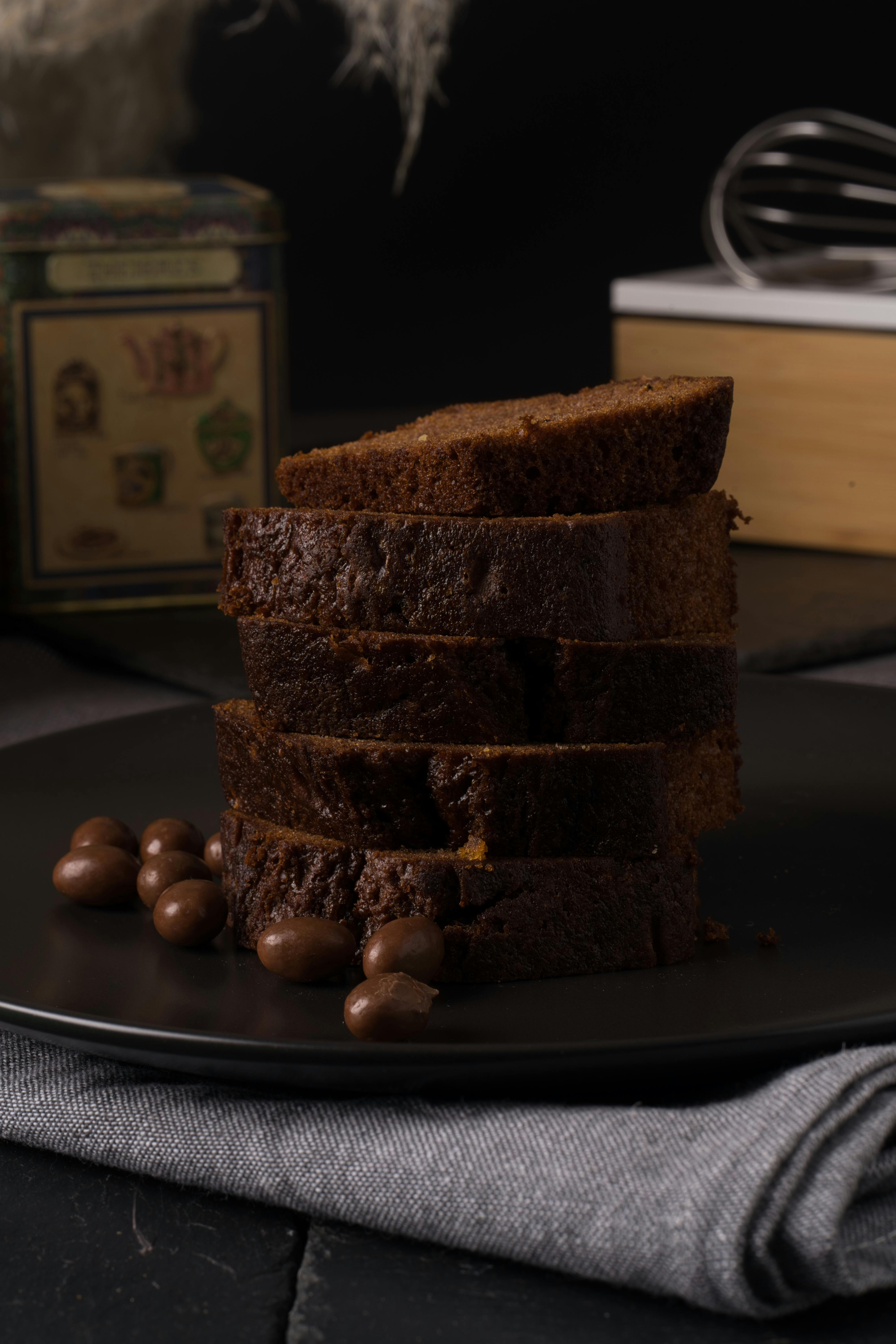 Stack of Chocolate Cake Slices on Dark Plate · Free Stock Photo