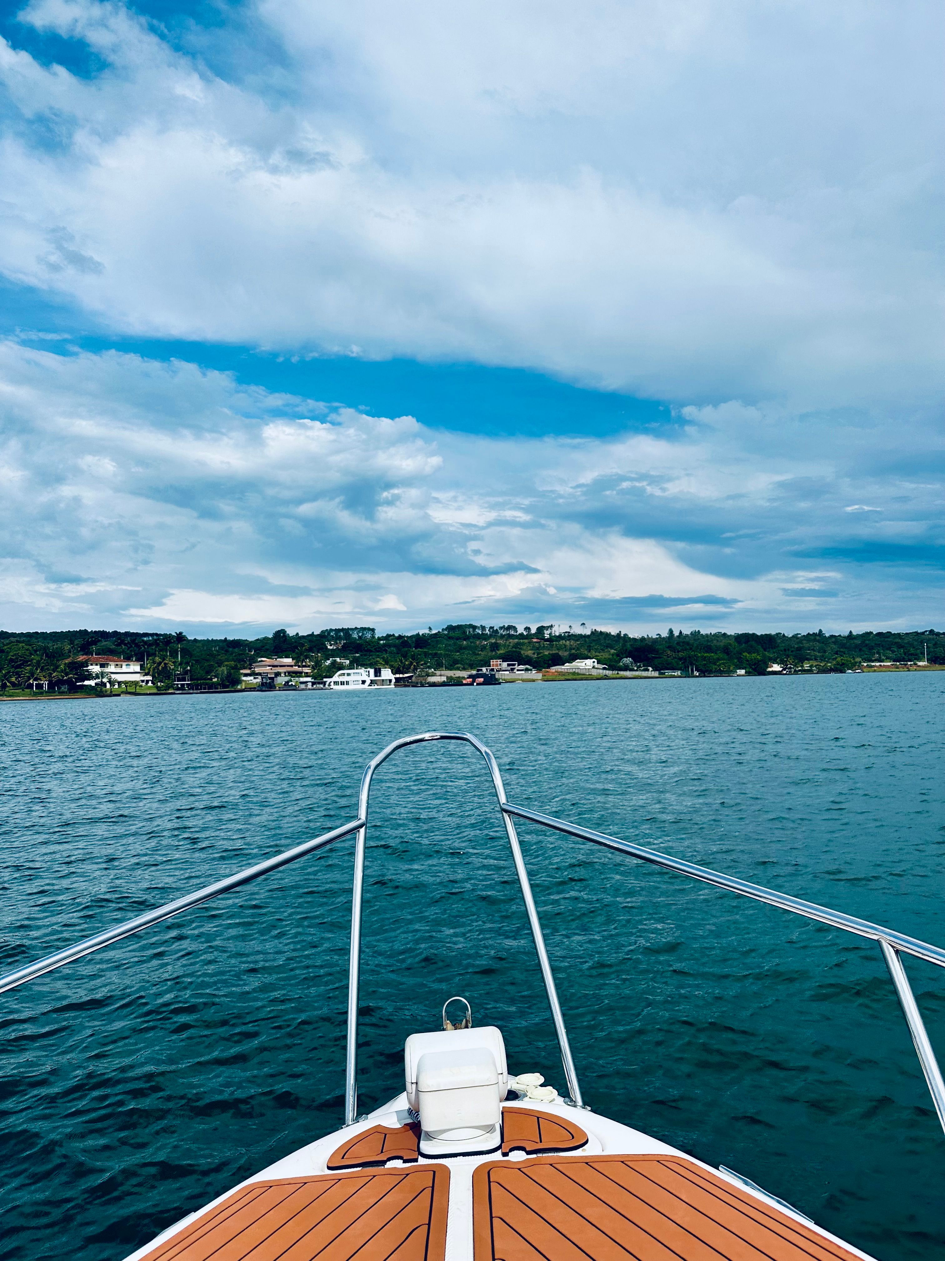 Scenic Boat Ride with Waterfront View · Free Stock Photo