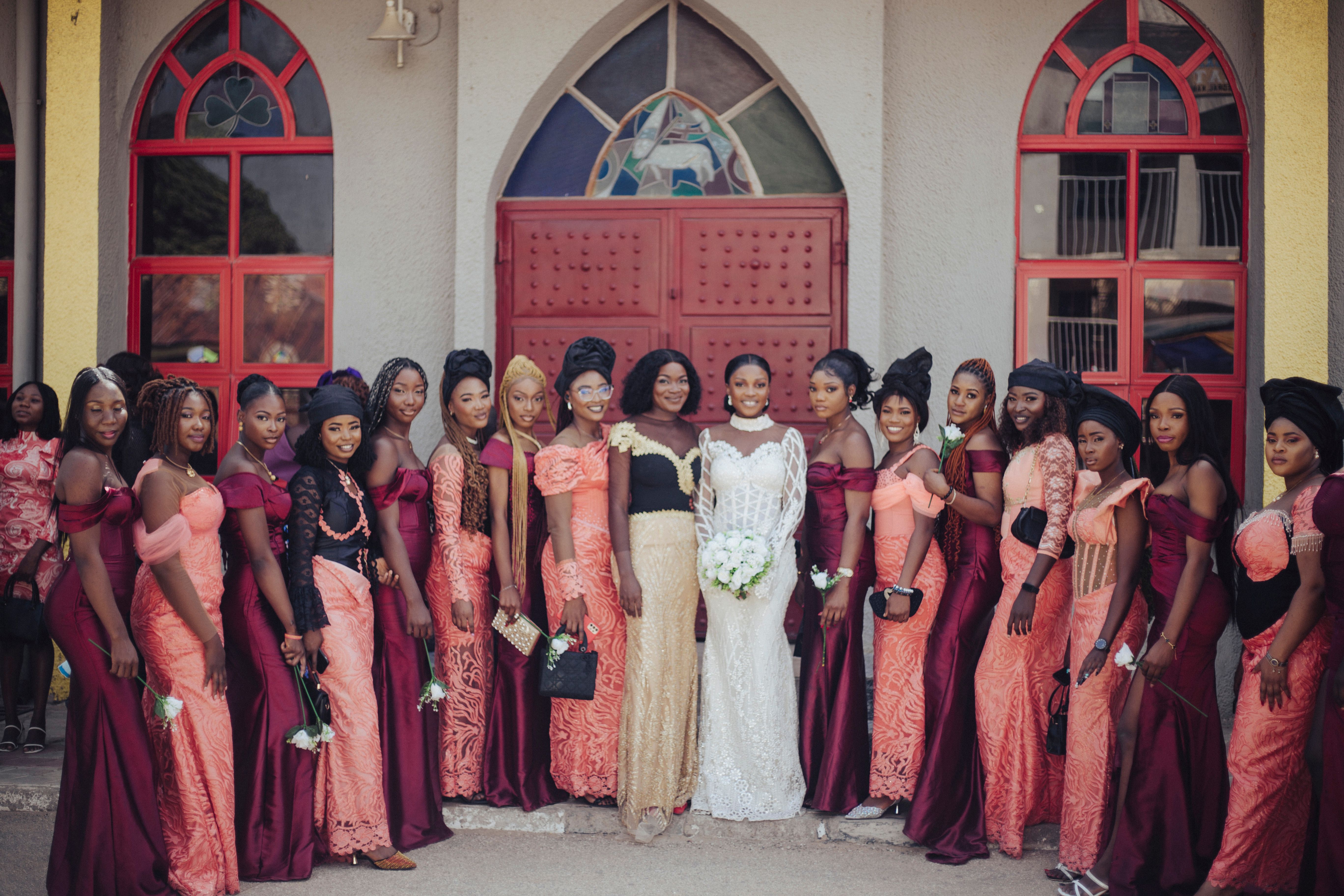 Vibrant Bridal Party Outside Church Ceremony · Free Stock Photo