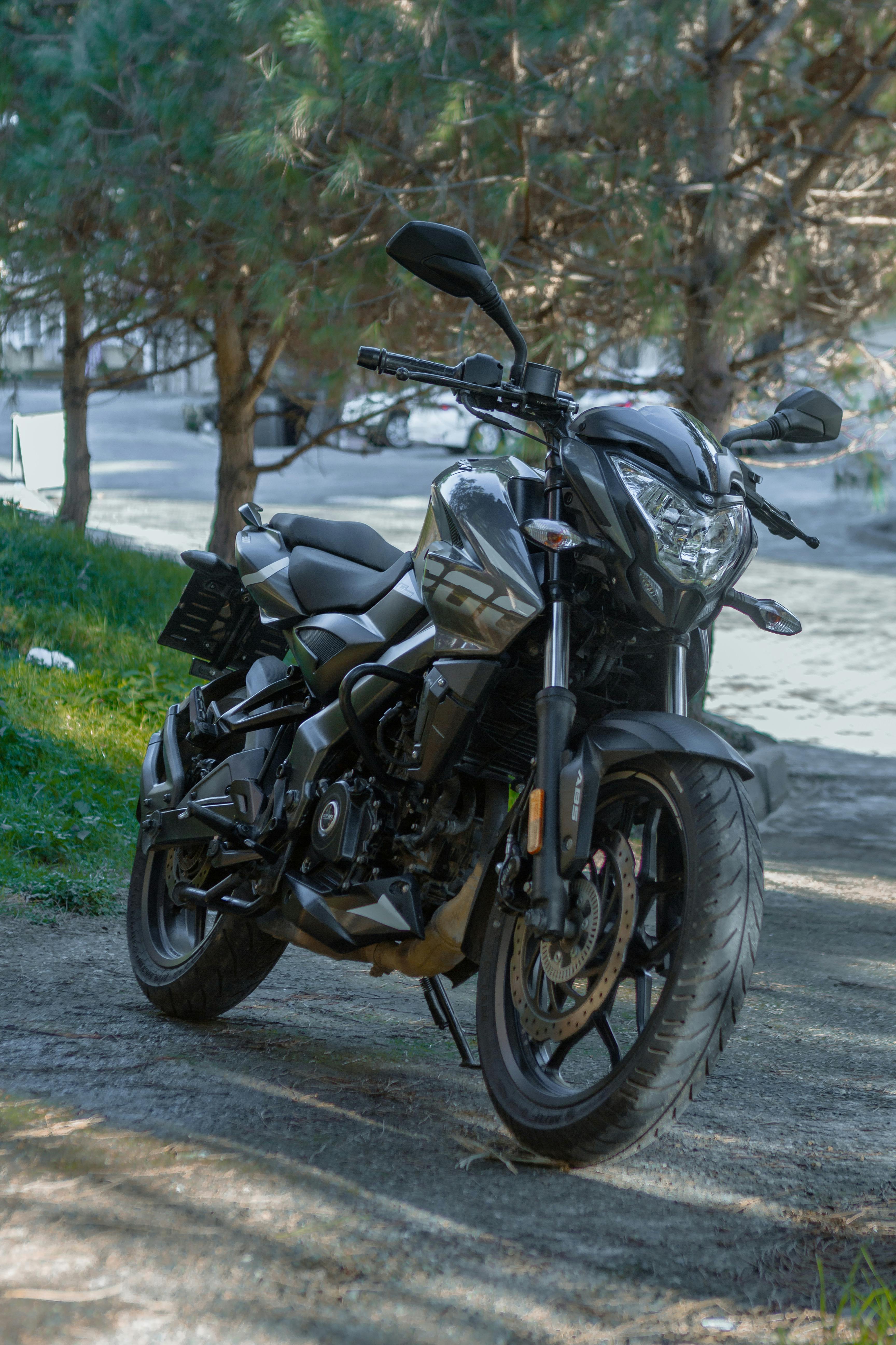 Sleek Motorcycle Parked Outdoors in Sunlight · Free Stock Photo