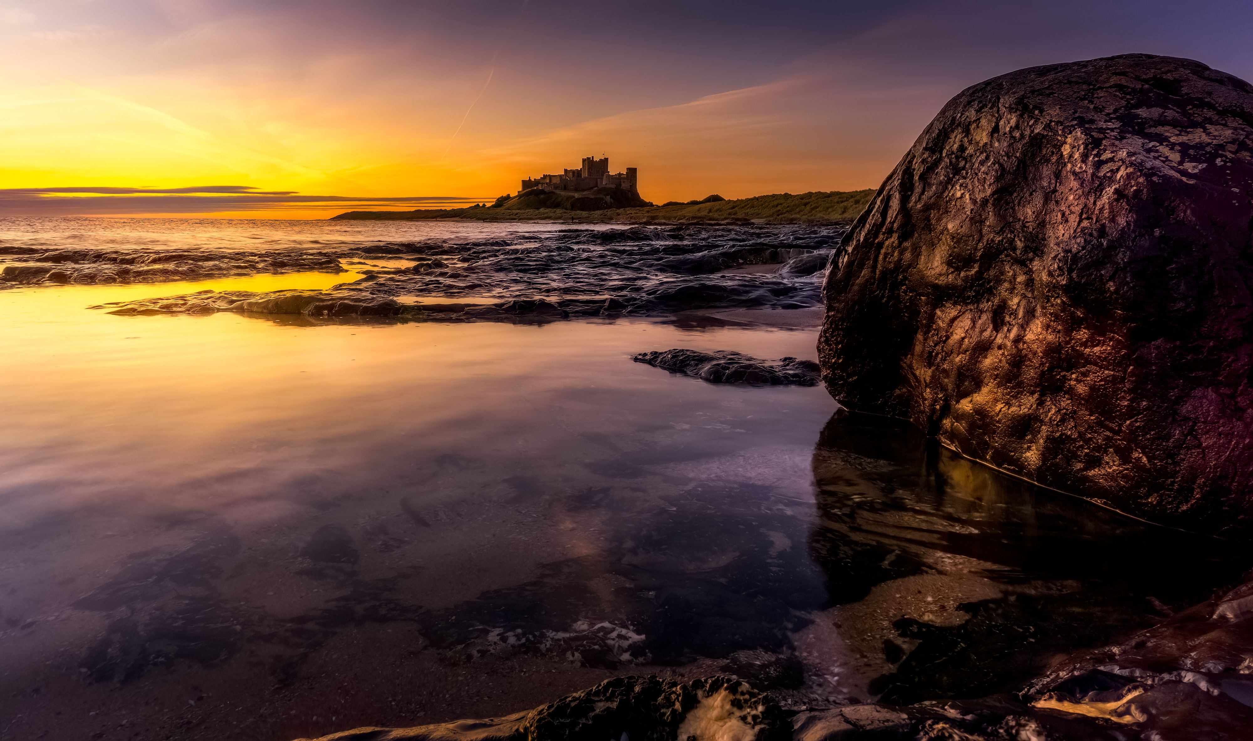 Serene Castle View at Sunrise by the Shore · Free Stock Photo