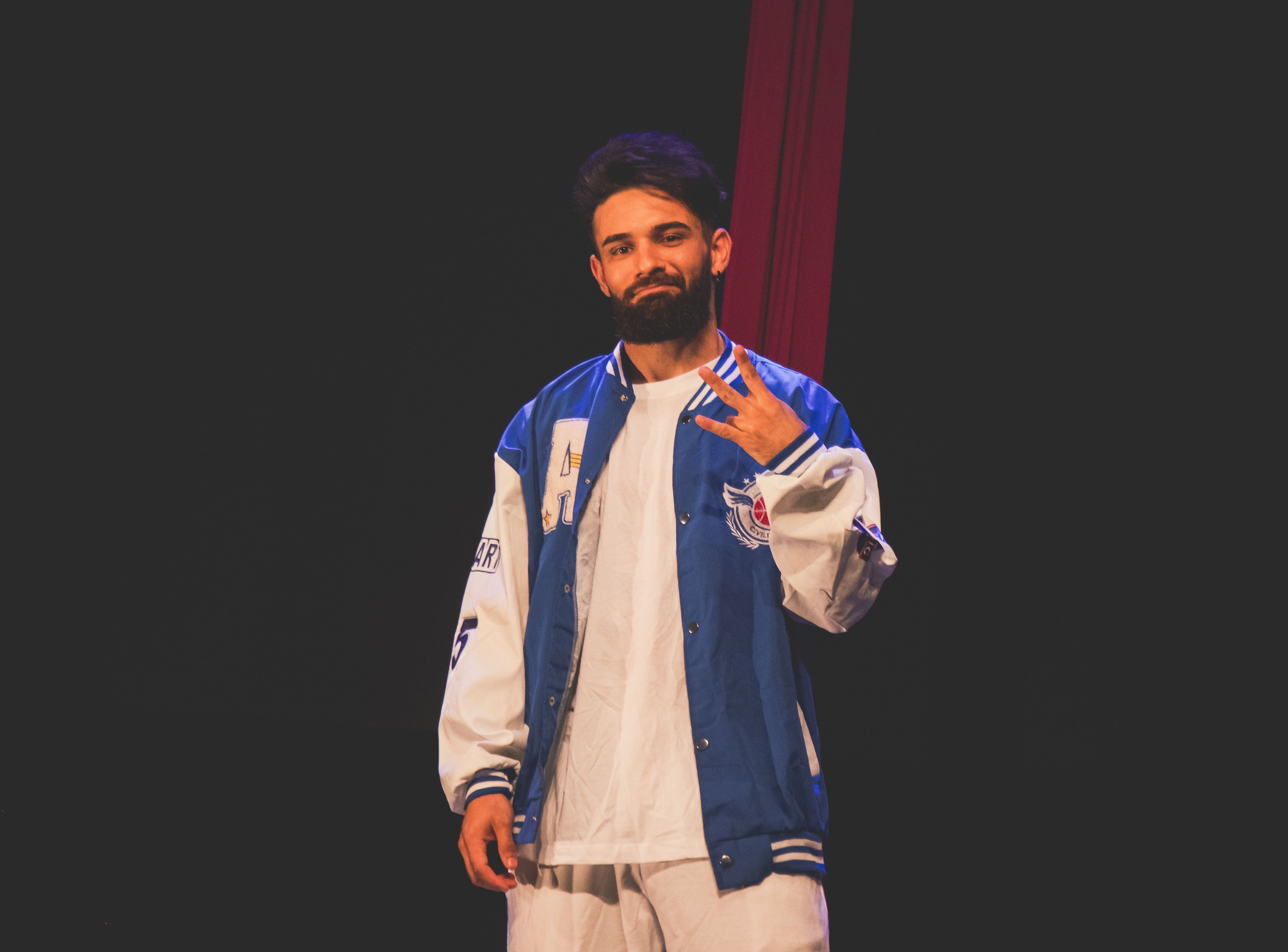 Hip Hop Performer with Blue Jacket on Stage · Free Stock Photo