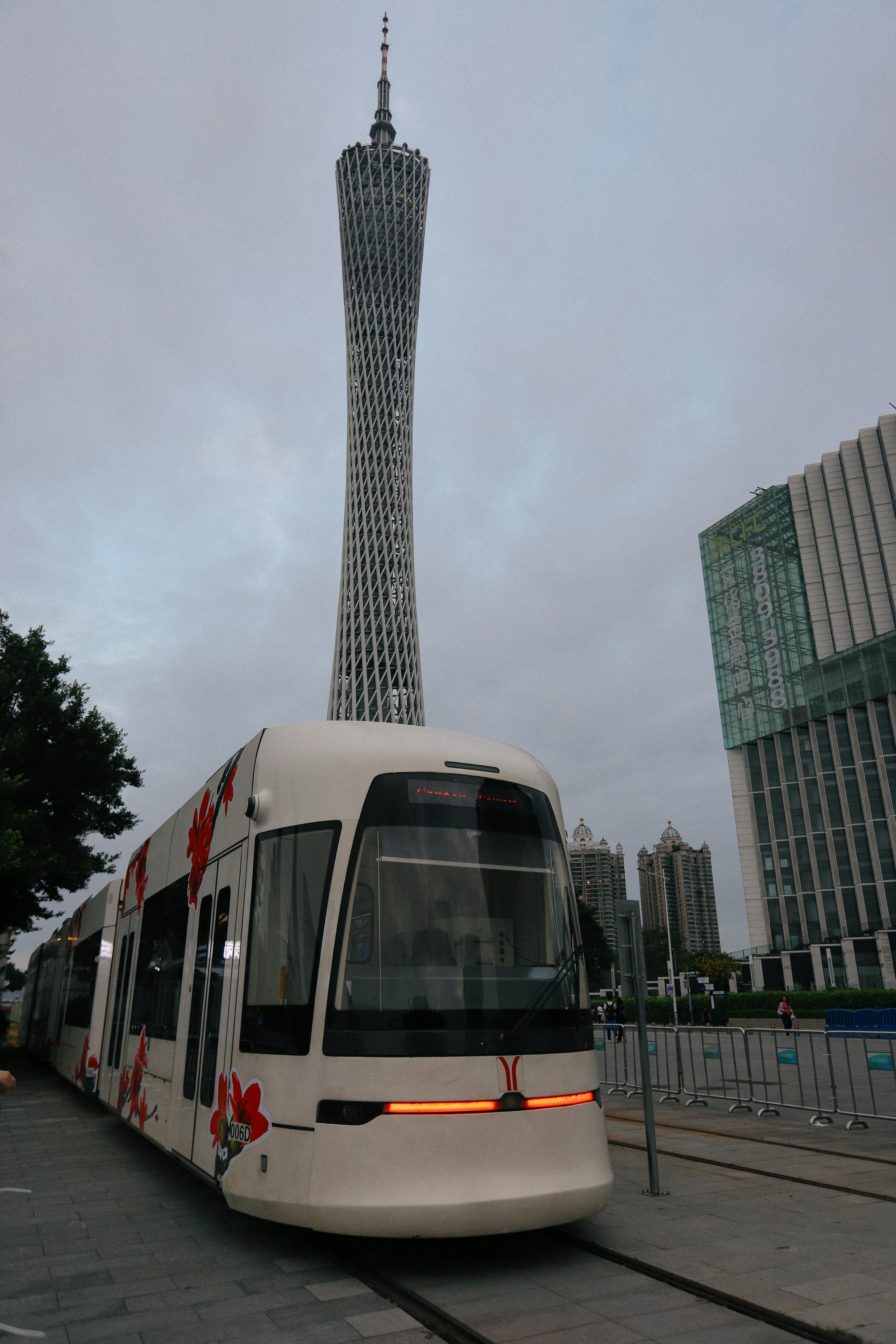 Modern Tram in Front of Canton Tower in Guangzhou · Free Stock Photo