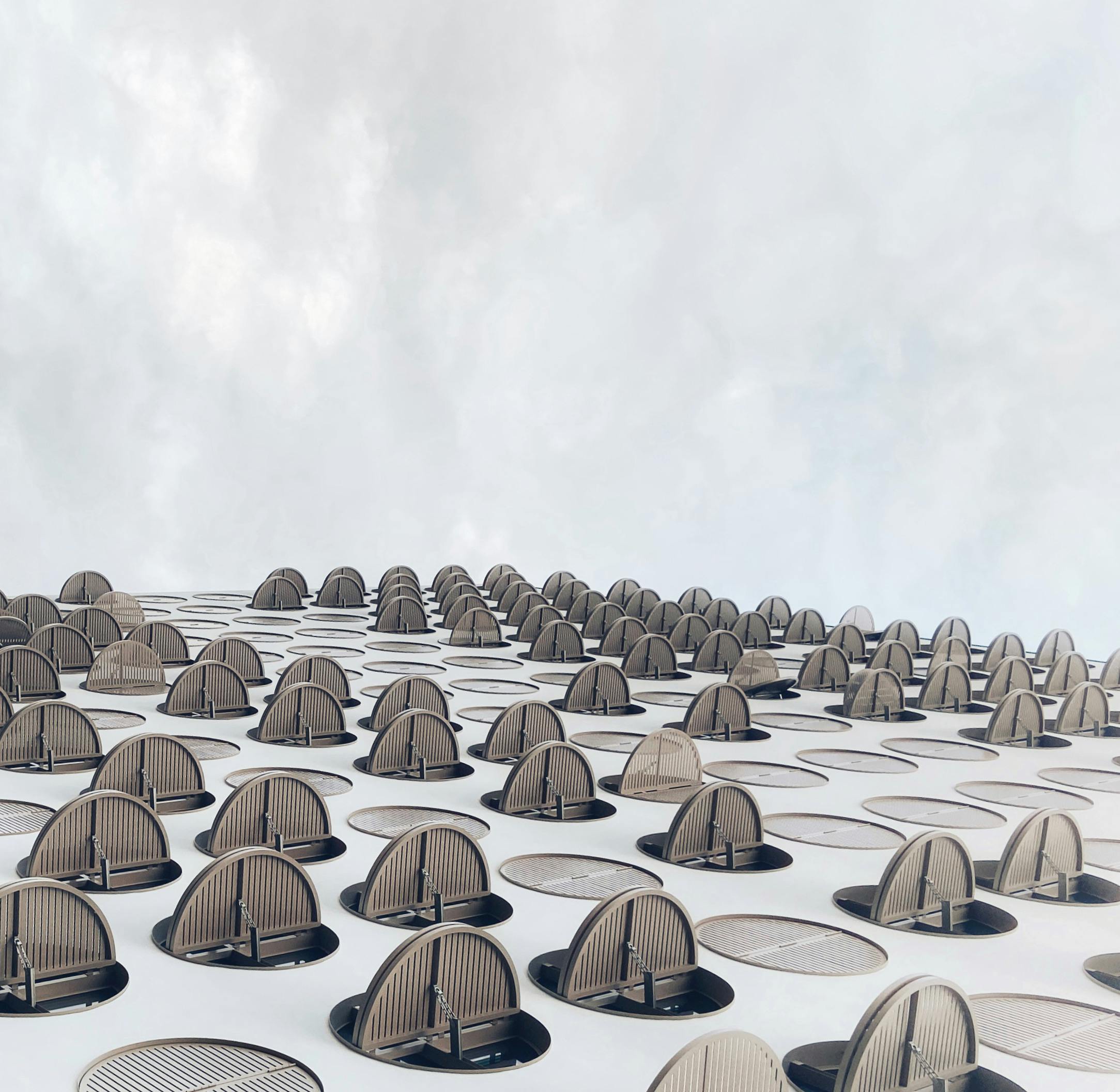 Modern Architectural Facade with Repetitive Patterns · Free Stock Photo