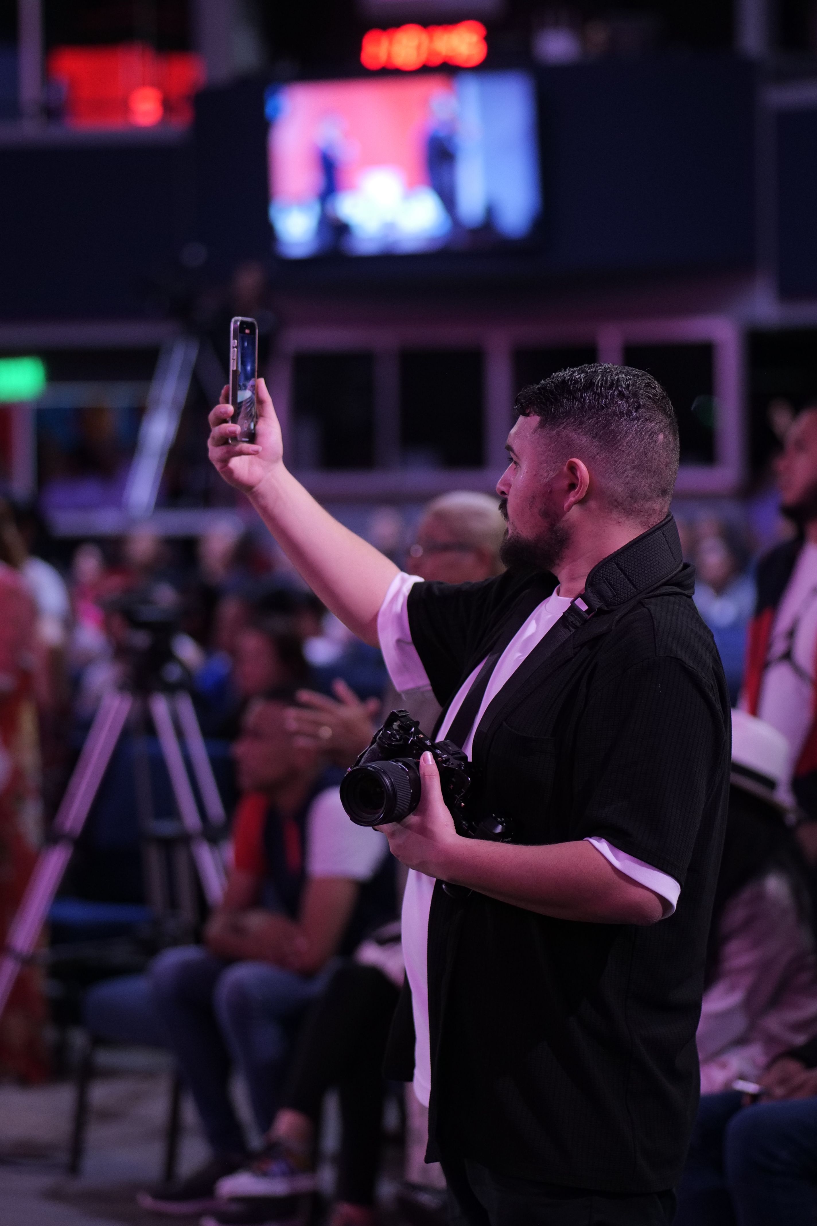 Photographer Capturing Event with Smartphone · Free Stock Photo