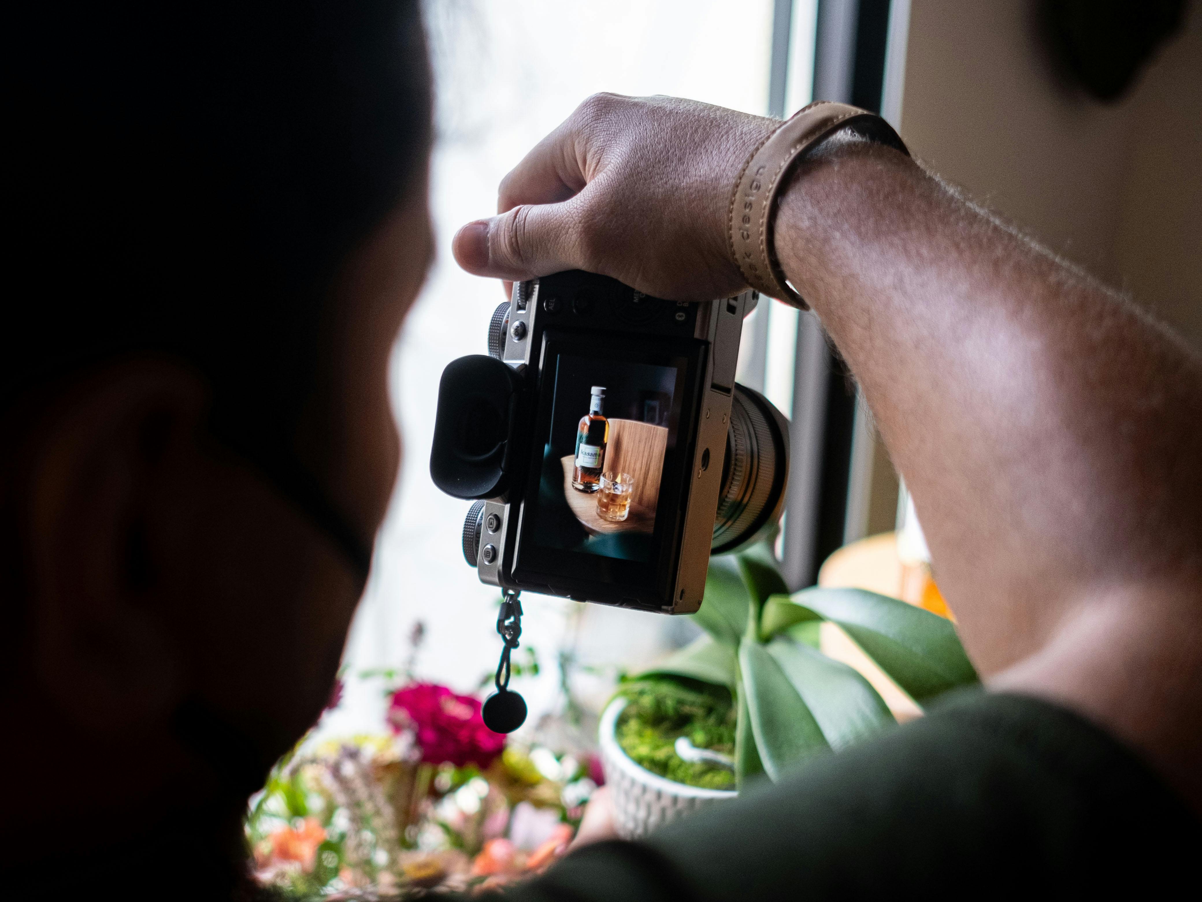 Professional Photographer Capturing Product Shot · Free Stock Photo