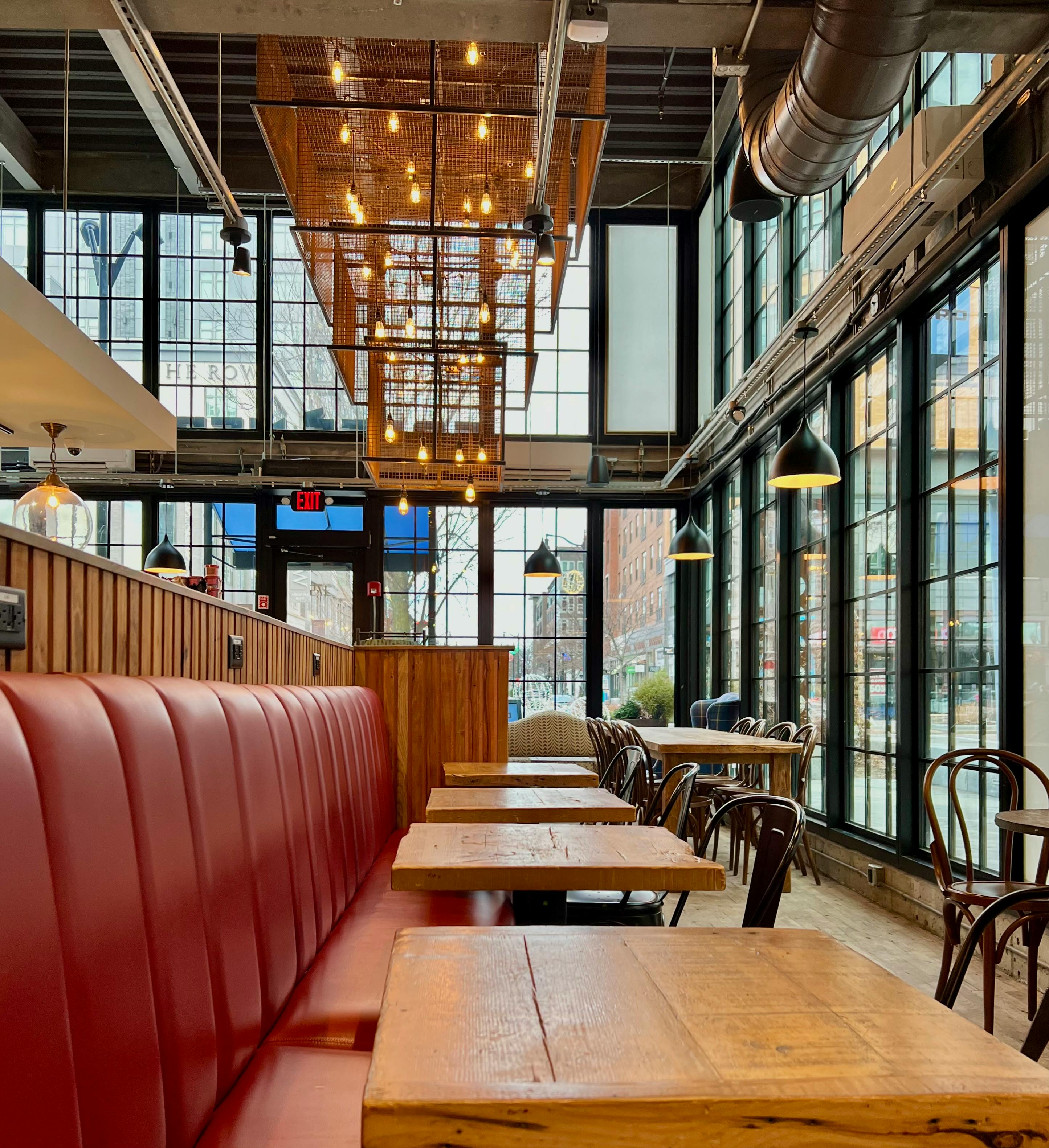 Stylish Modern Restaurant Interior with Large Windows · Free Stock Photo