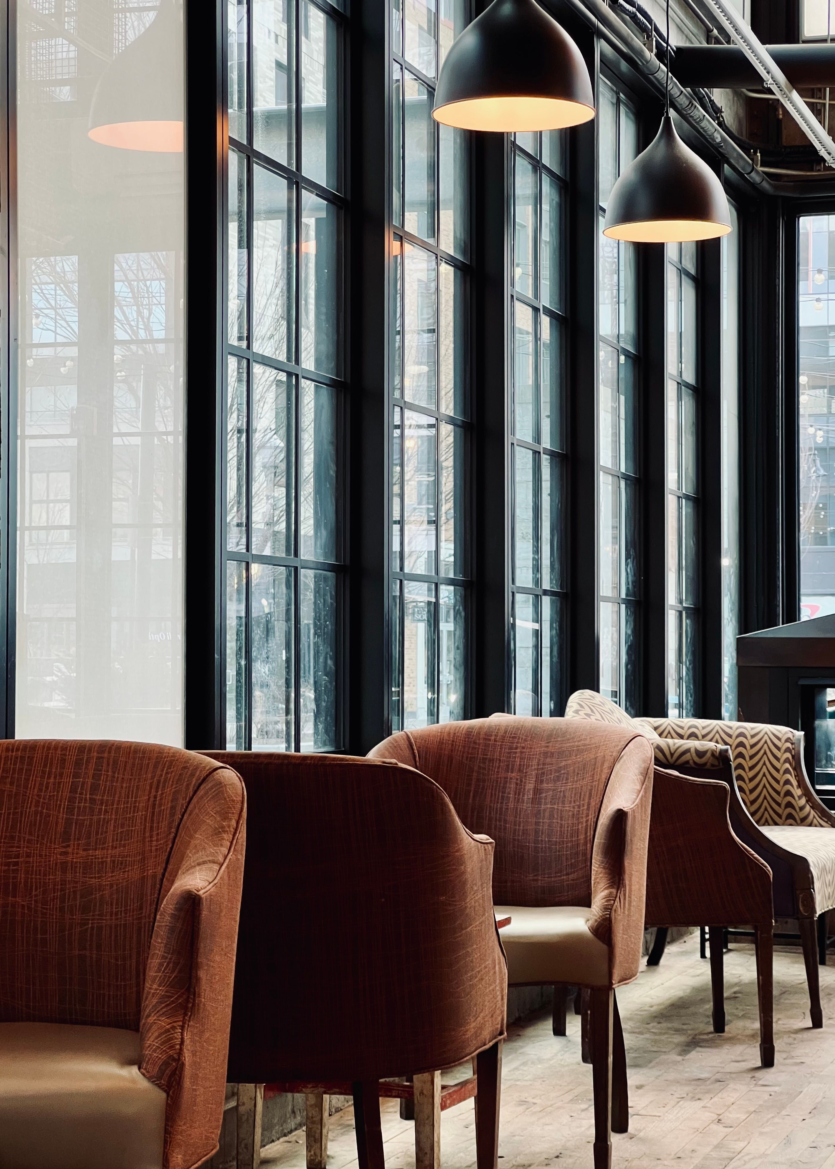 Cozy Indoor Cafe with Elegant Seating and Lighting · Free Stock Photo