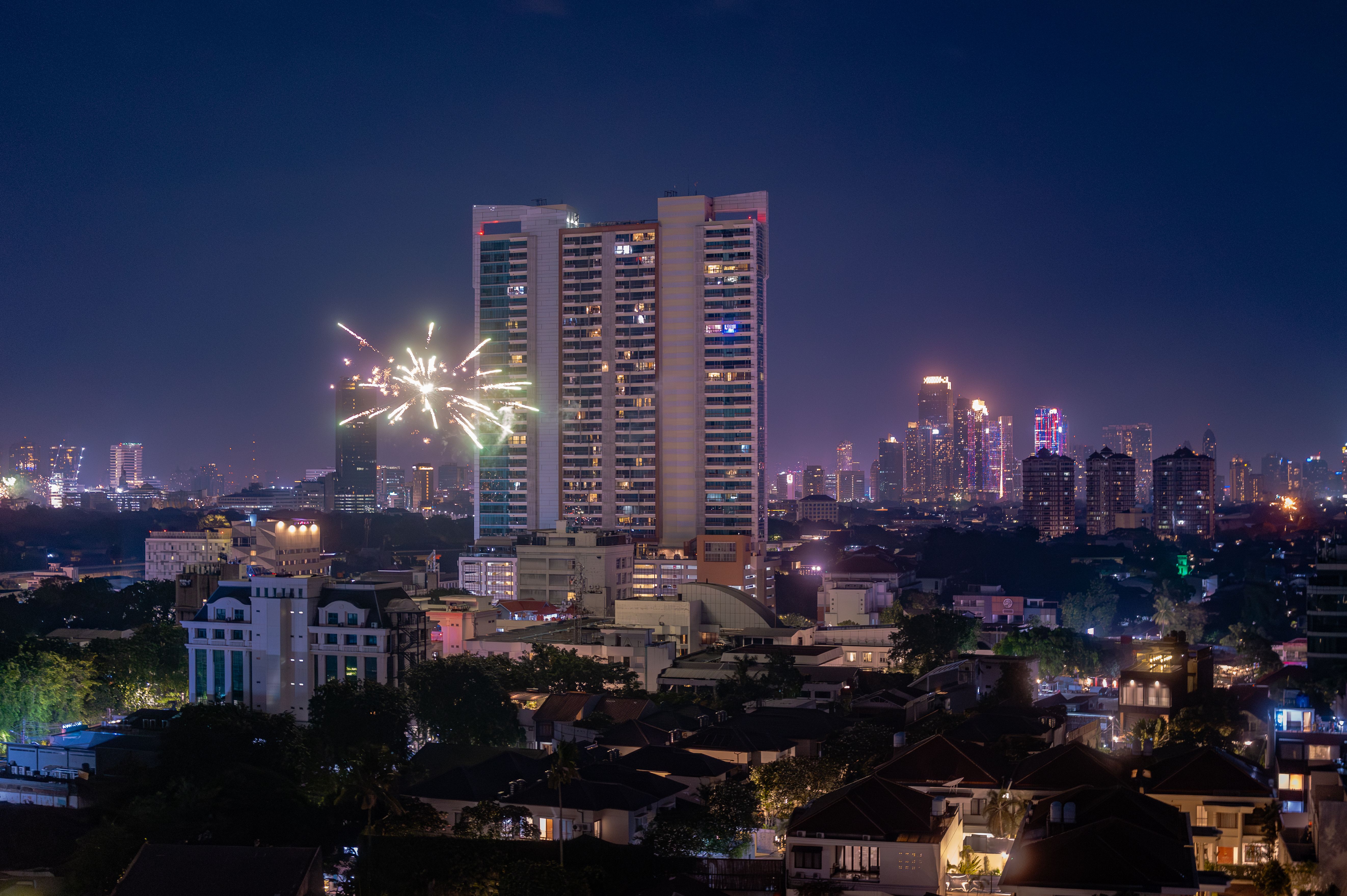 Jakarta Skyline Illuminated by New Year Fireworks · Free Stock Photo