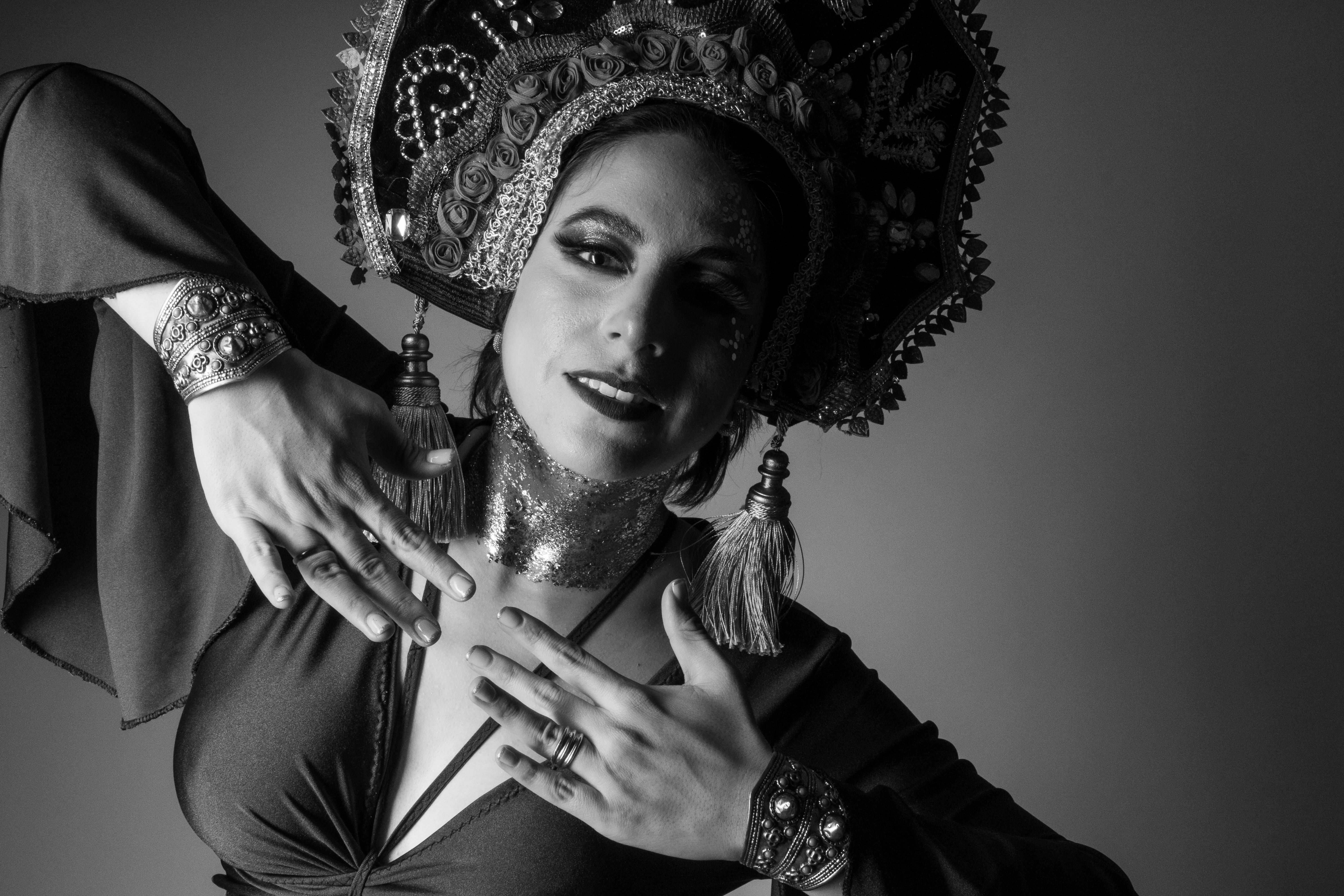 Portrait of a Romani Dancer in Traditional Headdress · Free Stock Photo