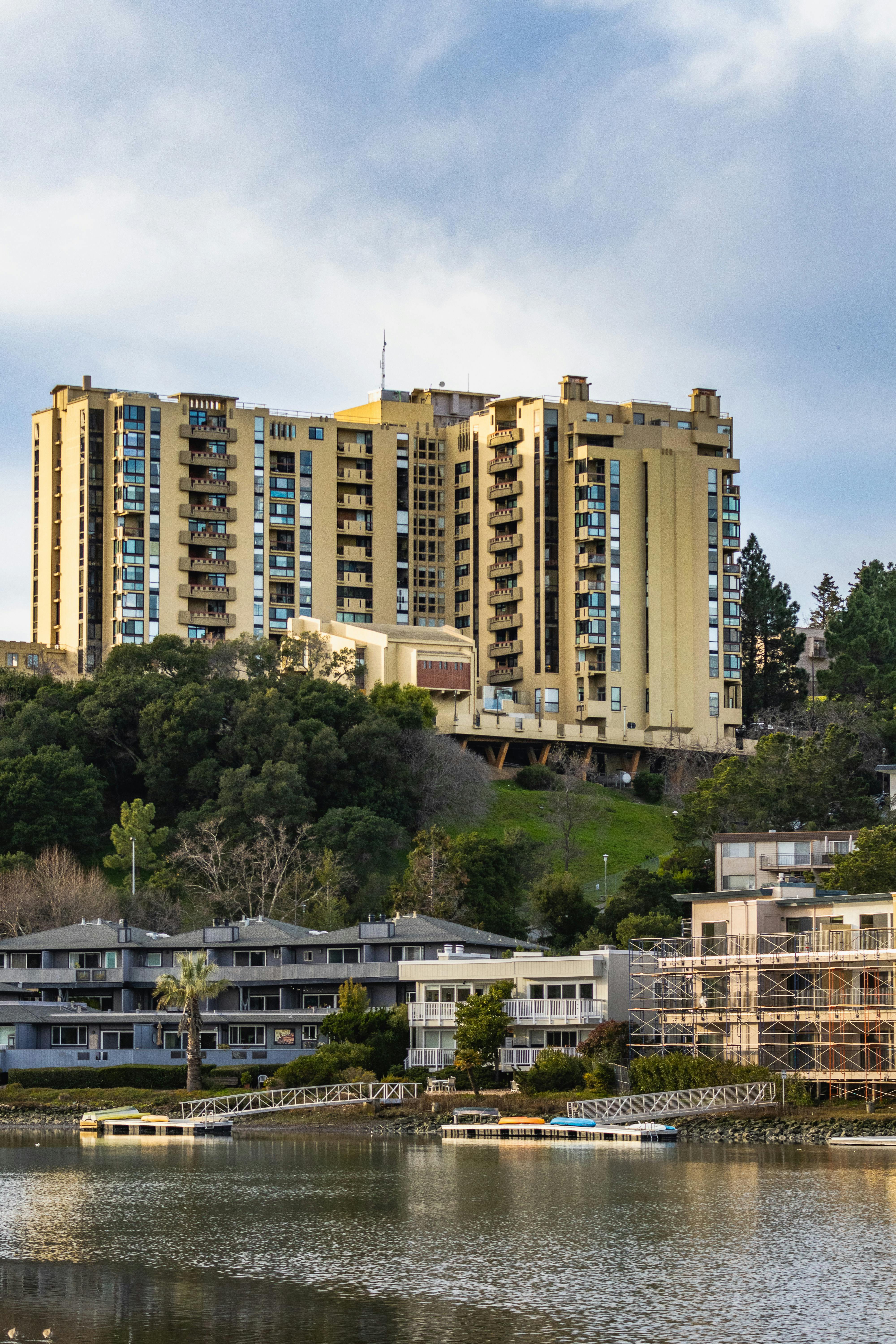 Modern Urban Residential Building by Waterfront · Free Stock Photo