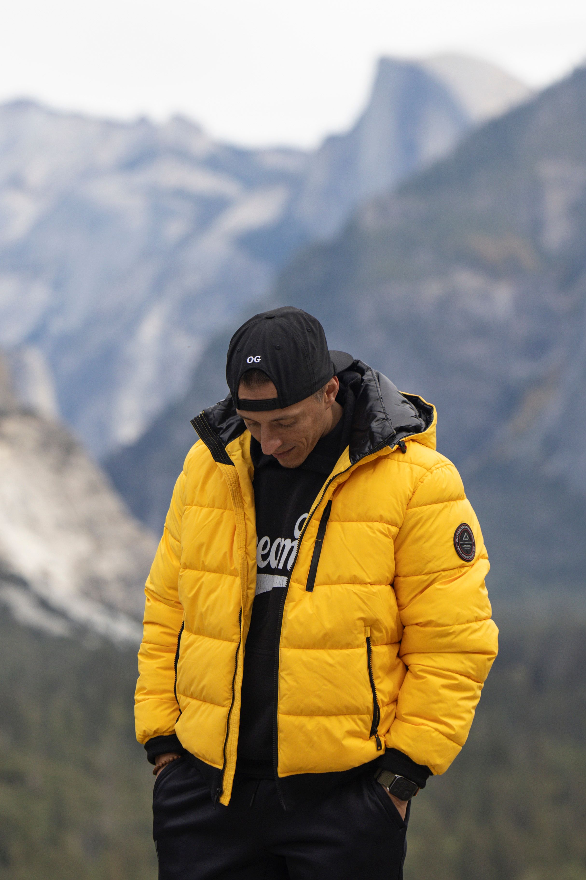 Man in Yellow Jacket in Scenic Mountain Landscape · Free Stock Photo