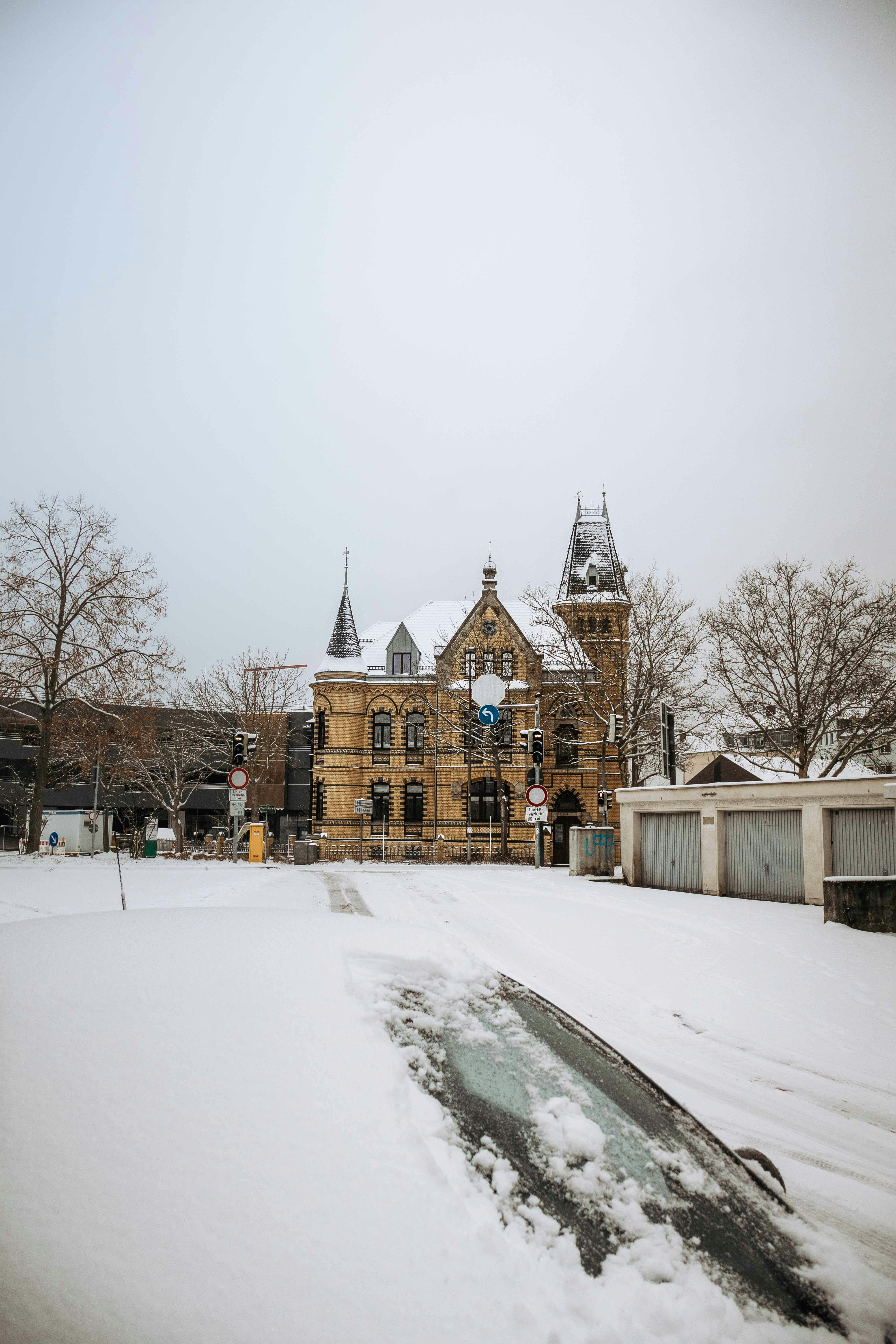 Historic Snow-Covered Building in Winter Scene · Free Stock Photo