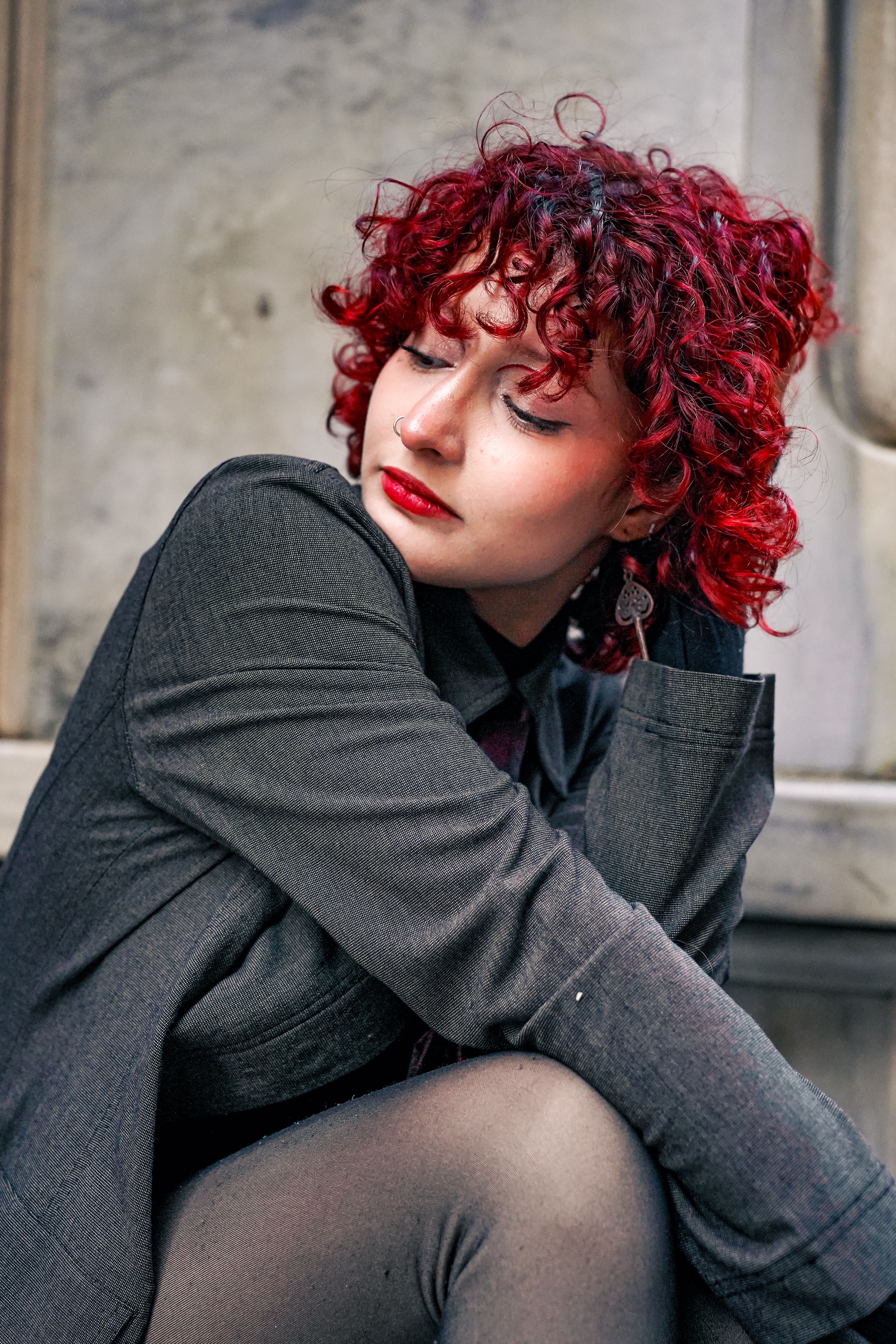 Portrait of Woman with Curly Red Hair in Gray Suit · Free Stock Photo