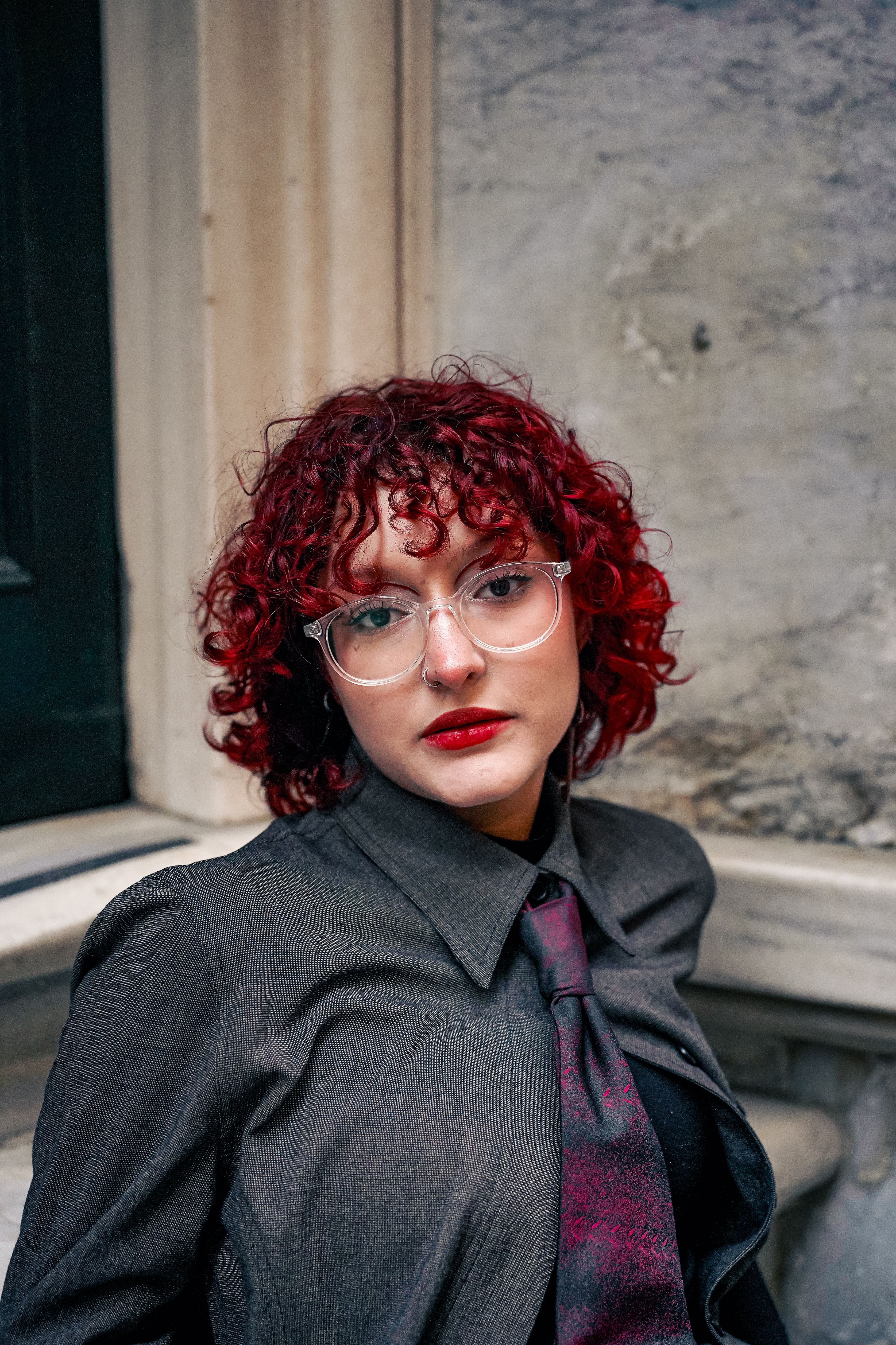 Red-haired Individual in Stylish Attire Outdoors · Free Stock Photo