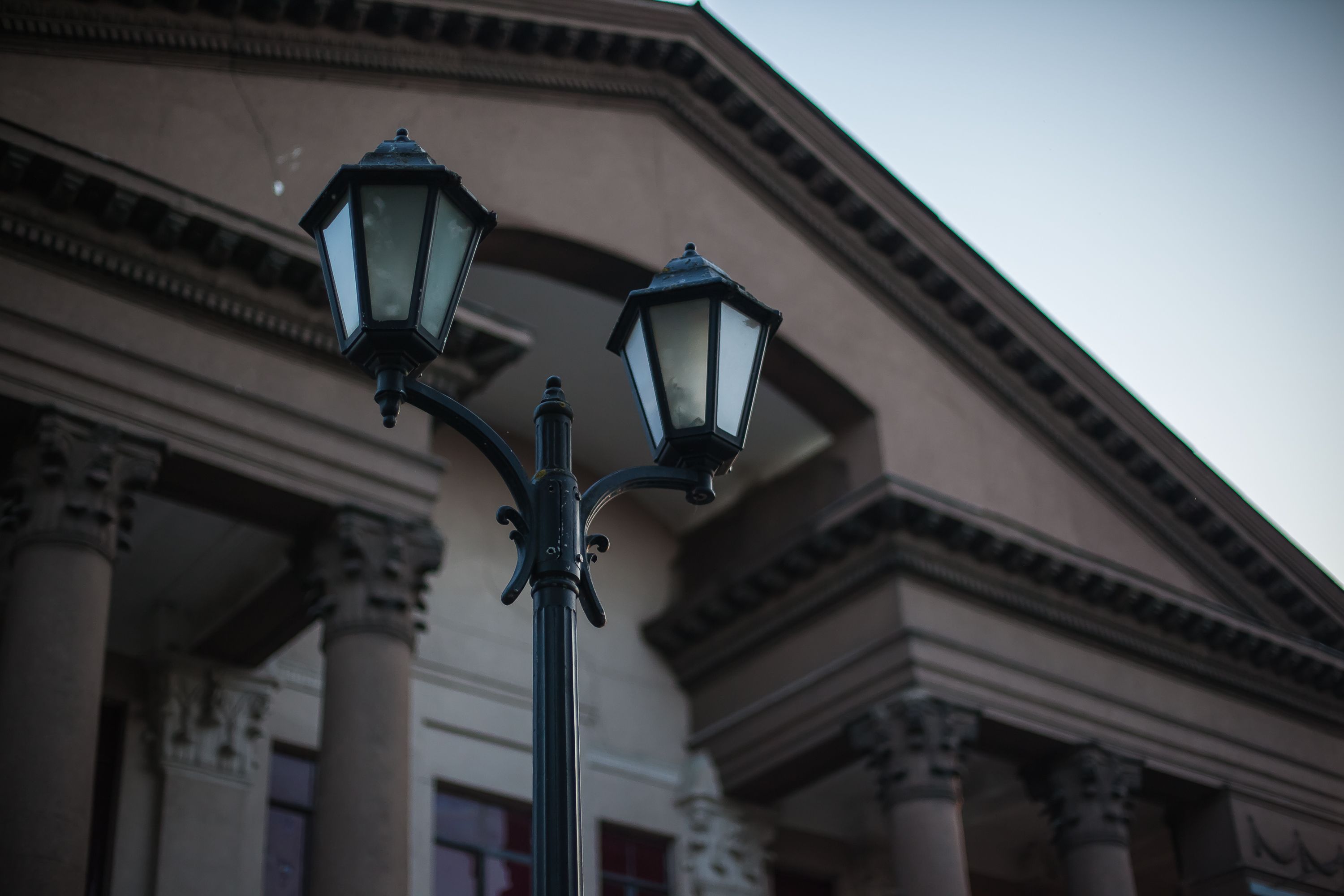 Elegant Street Lamp with Historic Architecture · Free Stock Photo