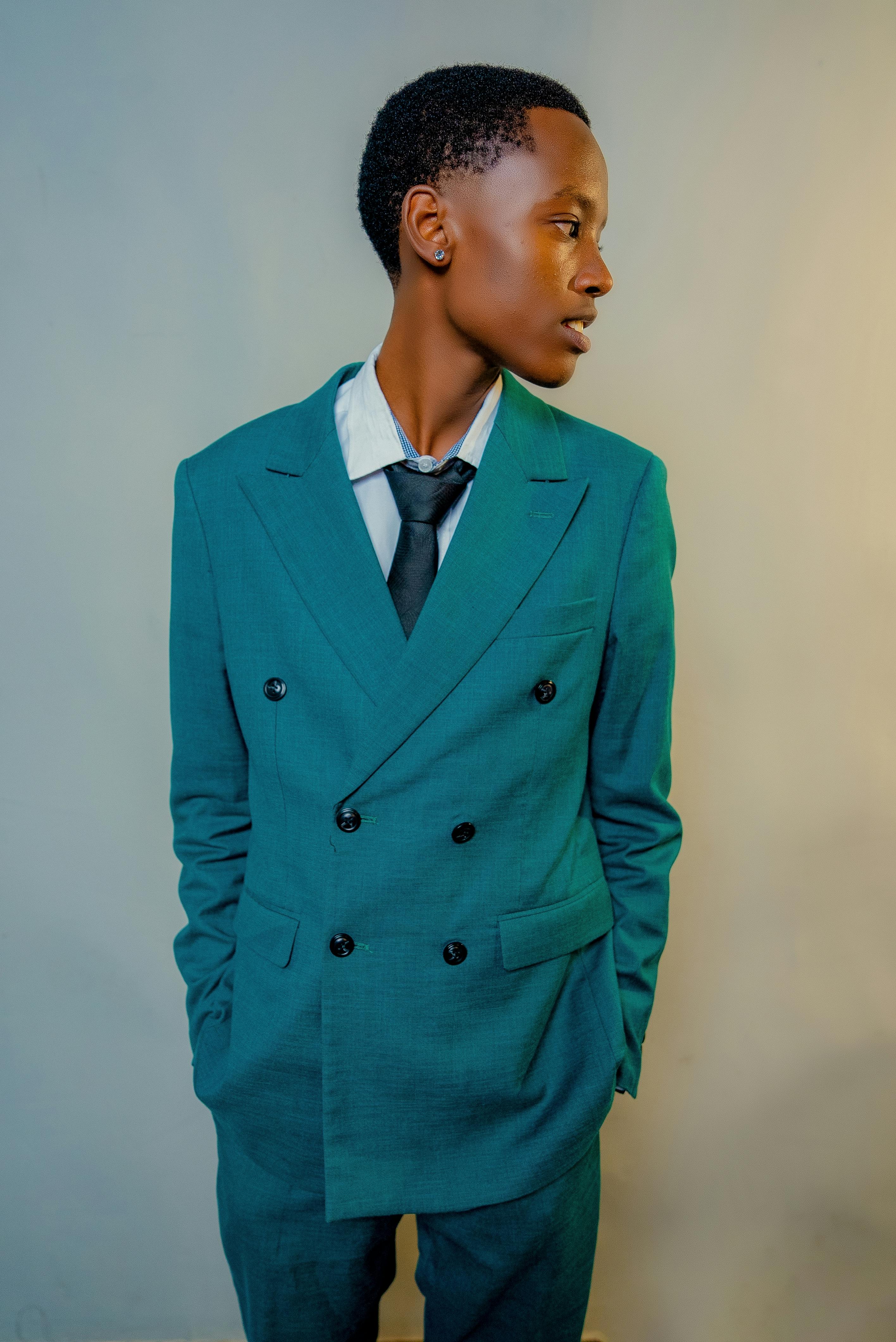Stylish Individual in Sharp Teal Double-Breasted Suit · Free Stock Photo