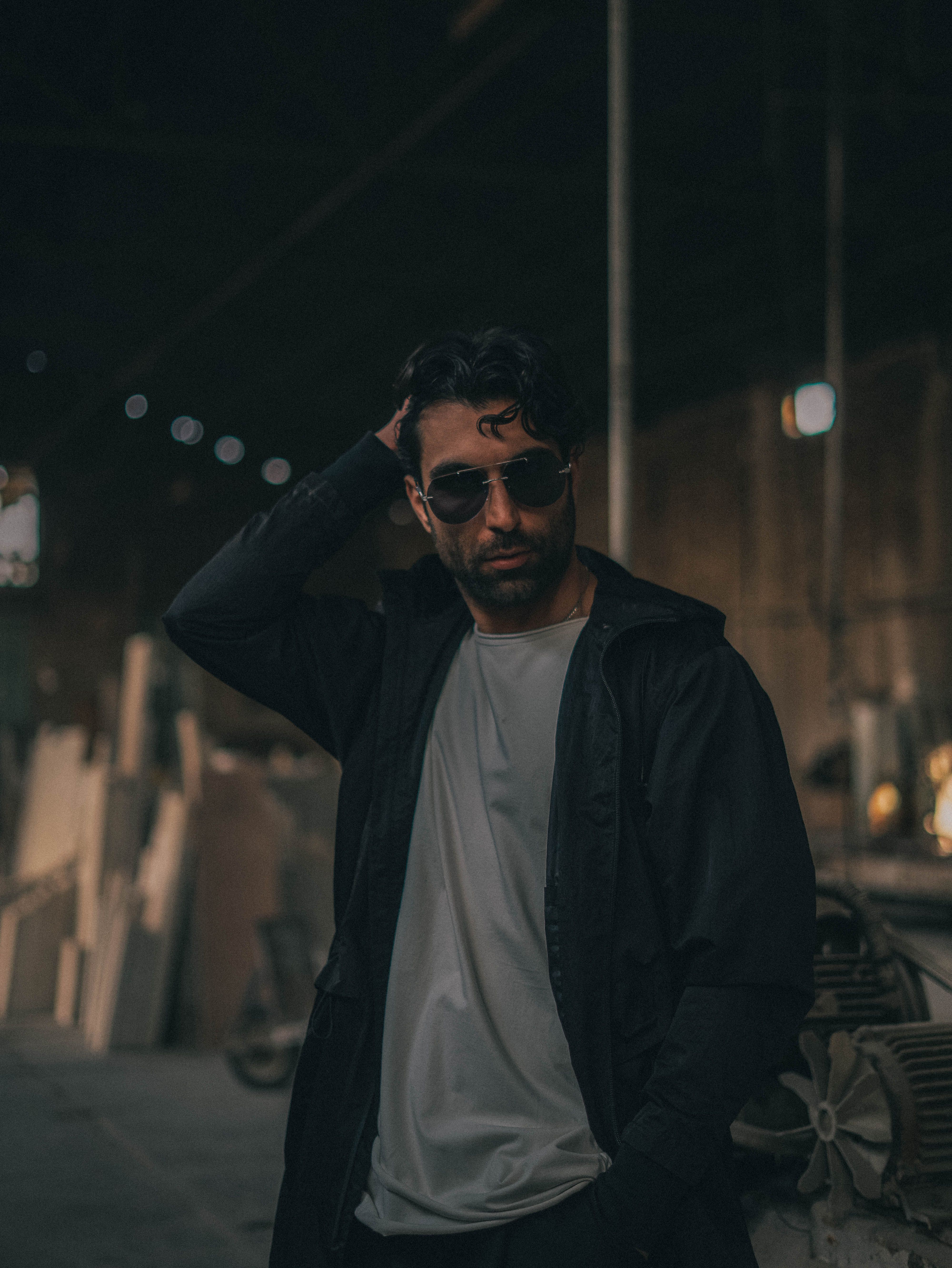 Moody Portrait of Man in Industrial Setting · Free Stock Photo