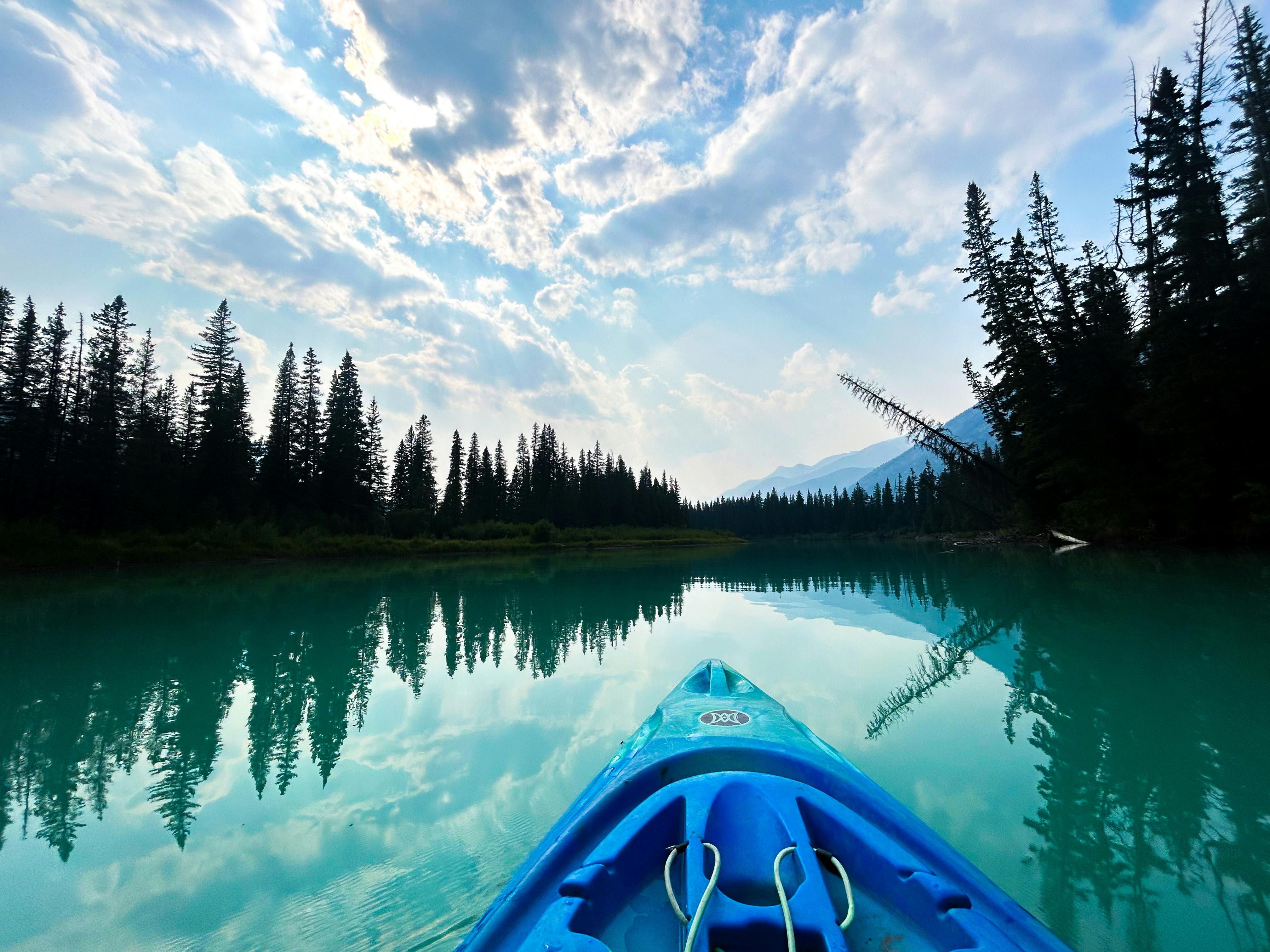 Peaceful Kayaking on Pristine Lake at Sunset · Free Stock Photo