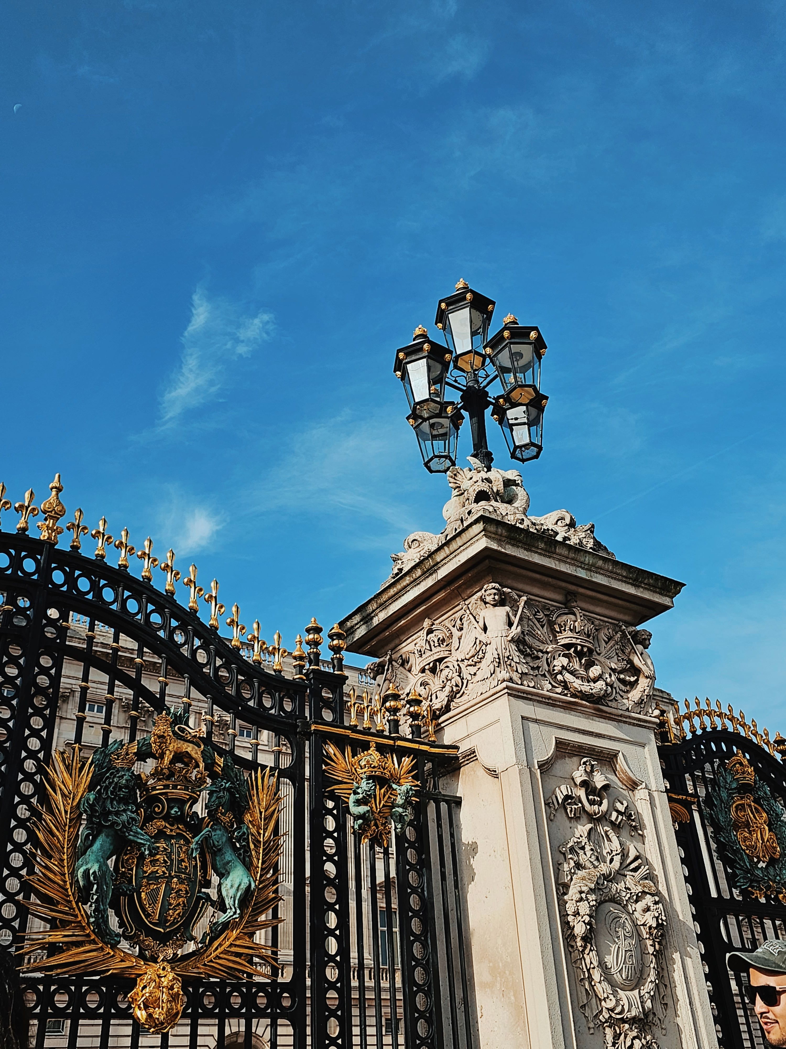 Ornate Palace Gate with Blue Sky Backdrop · Free Stock Photo