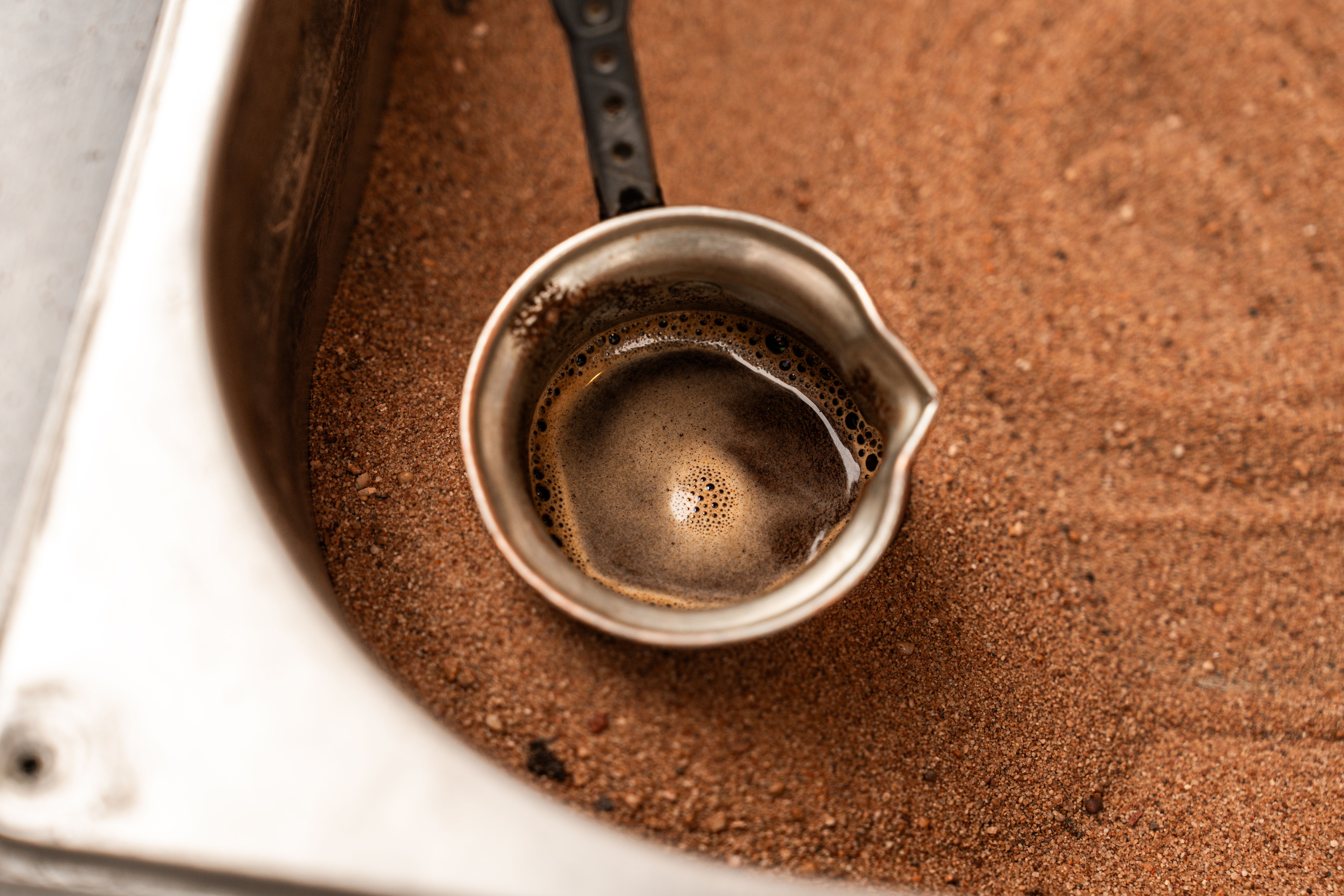 Traditional Turkish Coffee Brewing in Sand · Free Stock Photo