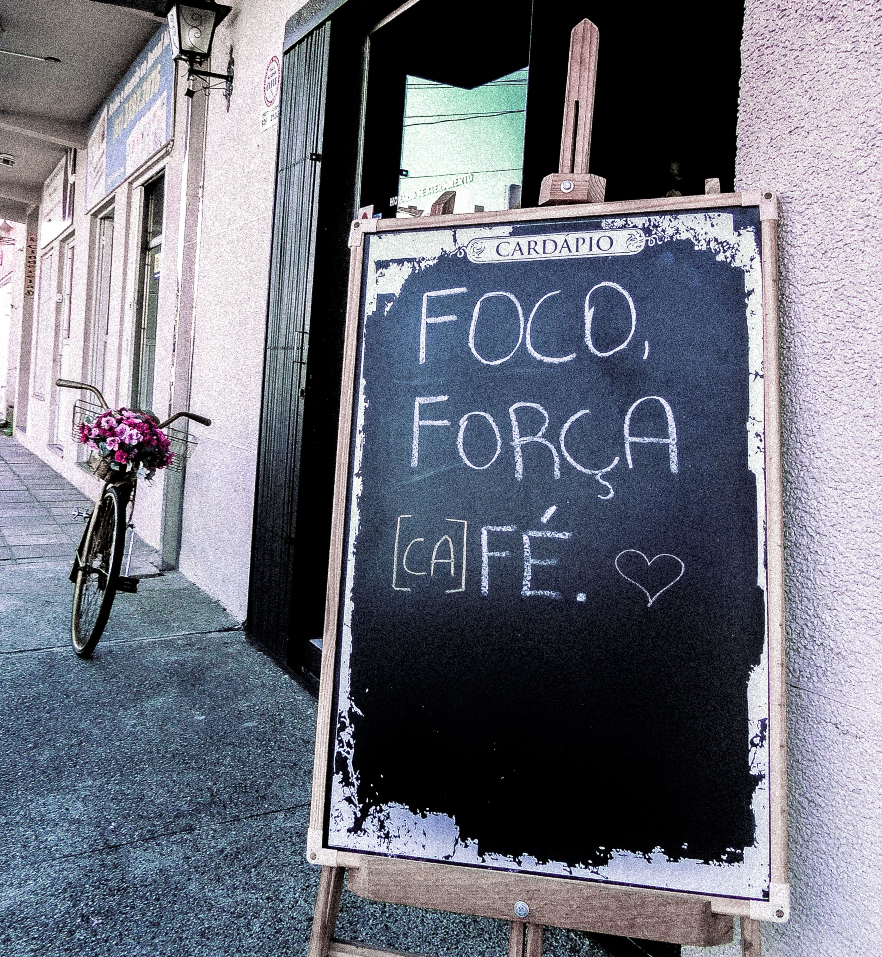Chalkboard Sign at Café Entrance with Bicycle · Free Stock Photo