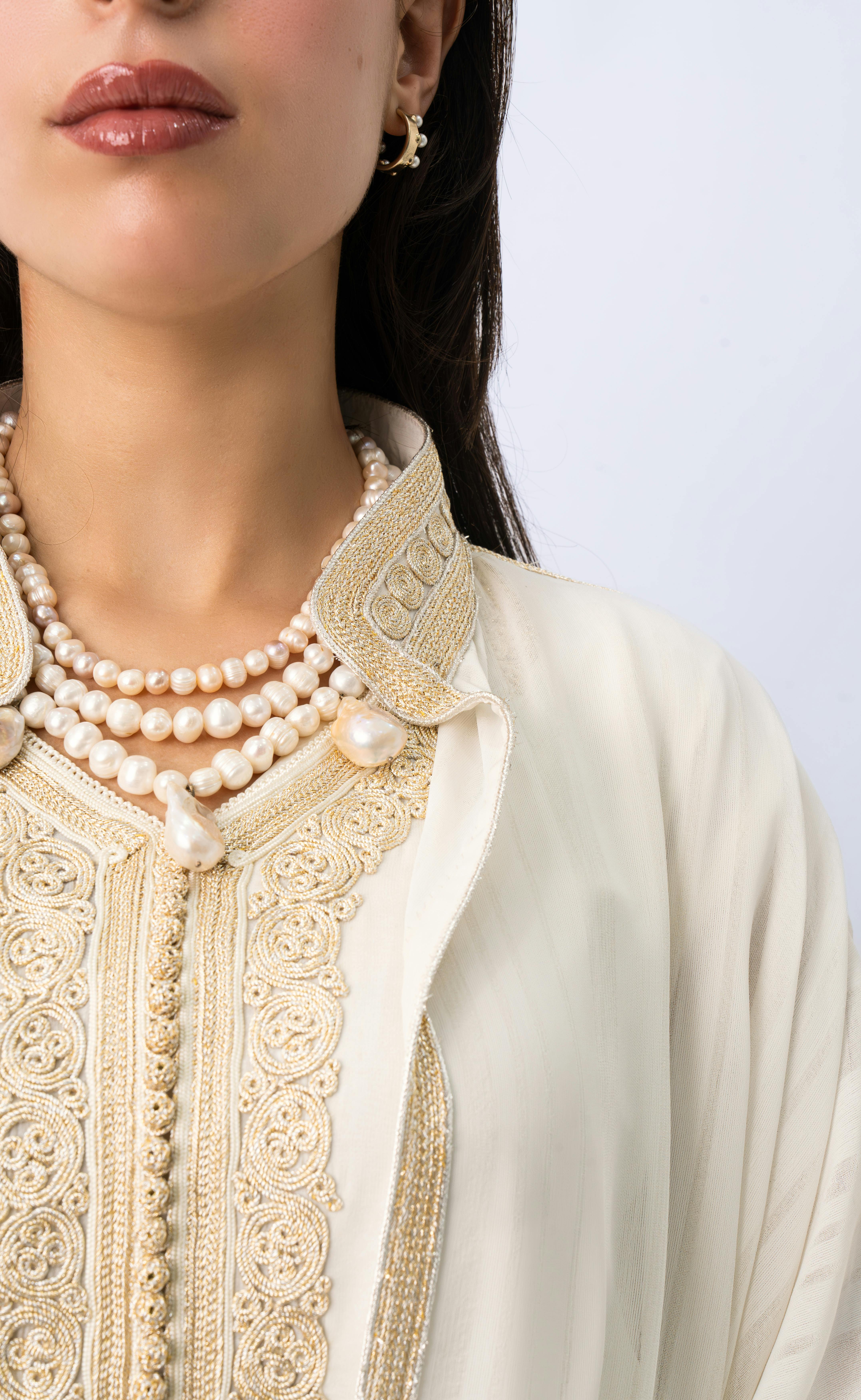 Elegant Moroccan Fashion Portrait with Pearls · Free Stock Photo