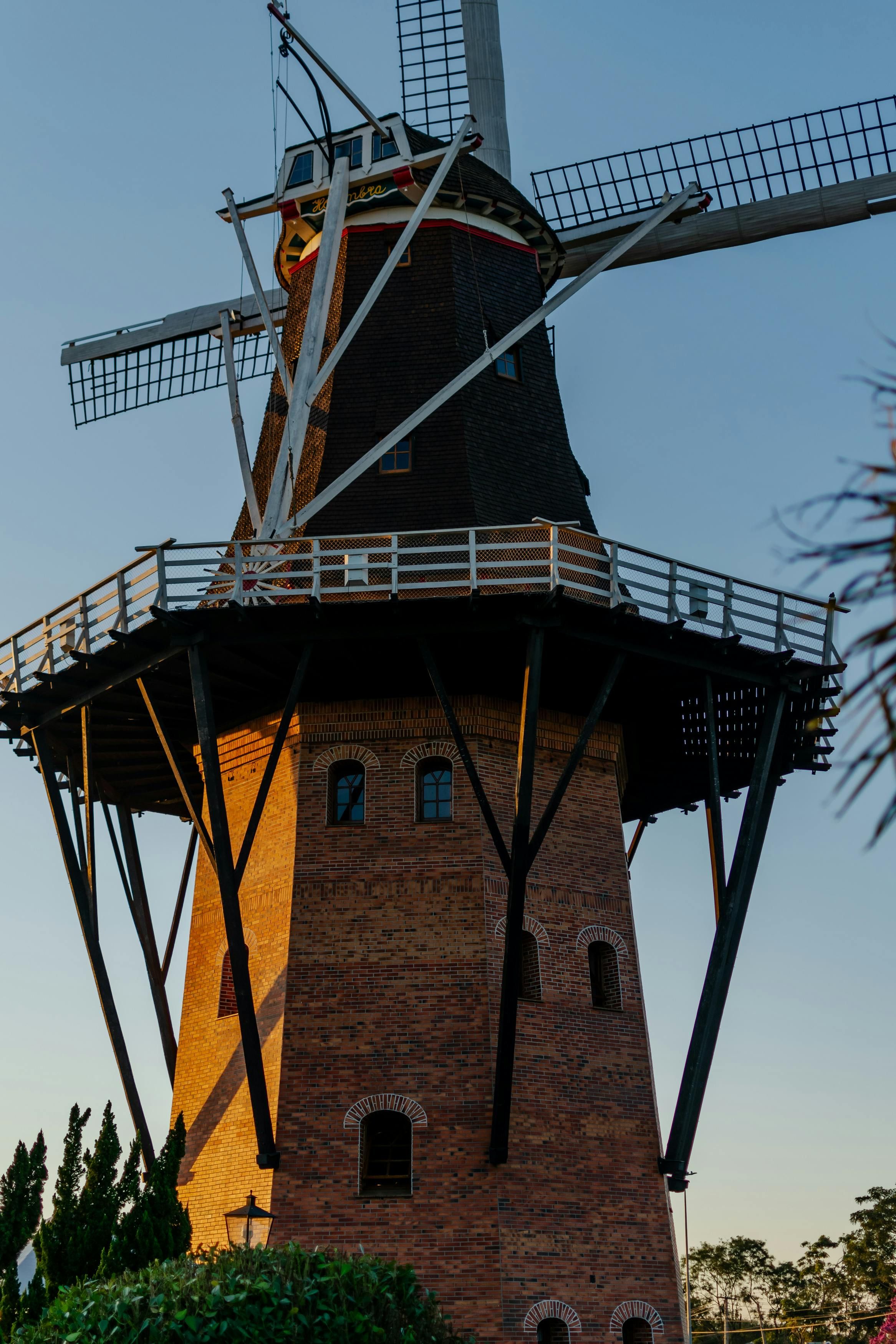 Majestic Dutch Windmill at Sunset · Free Stock Photo