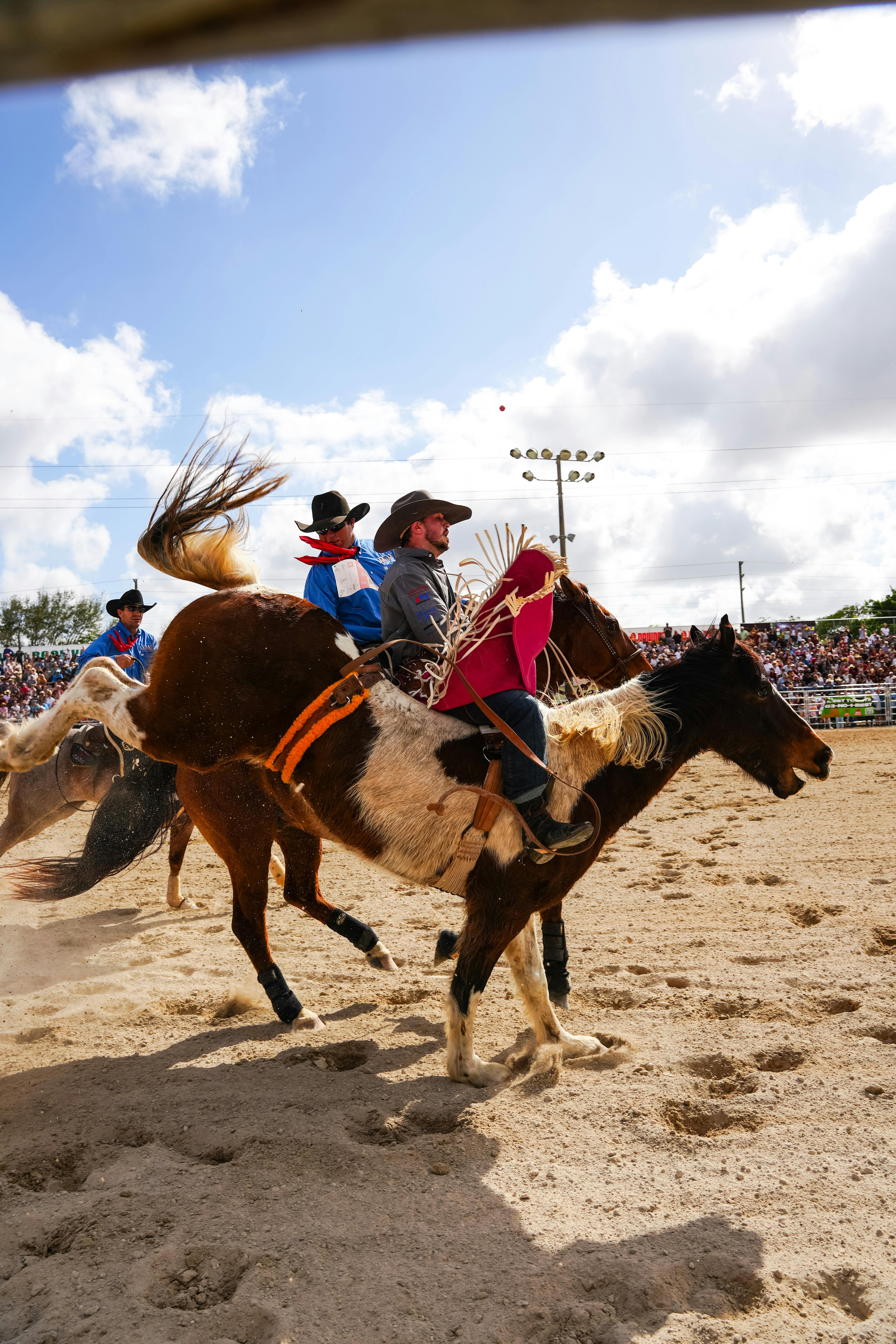 Exciting Rodeo Riders at Outdoor Event · Free Stock Photo
