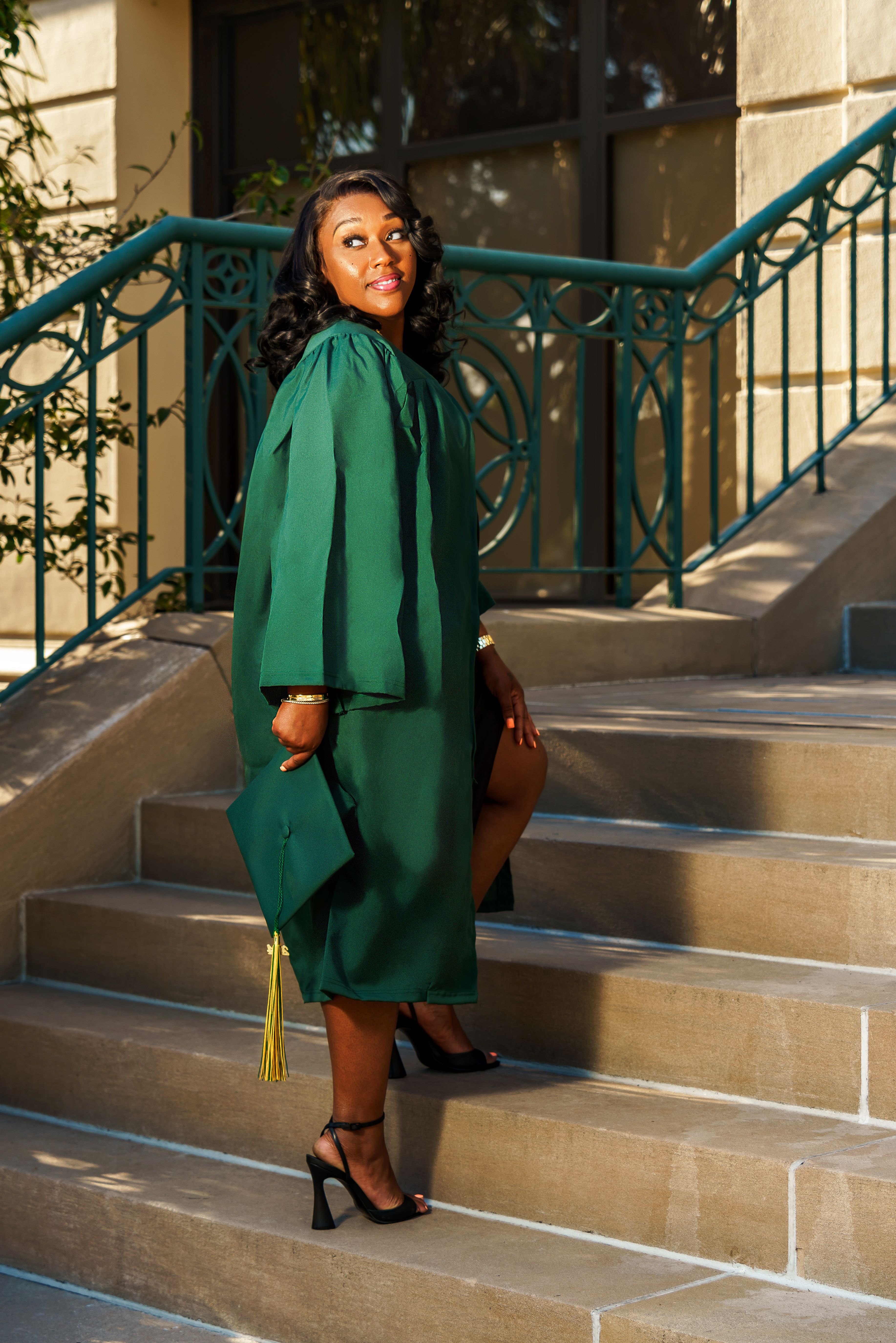Elegant Graduate in Green Gown Posing Outdoors · Free Stock Photo