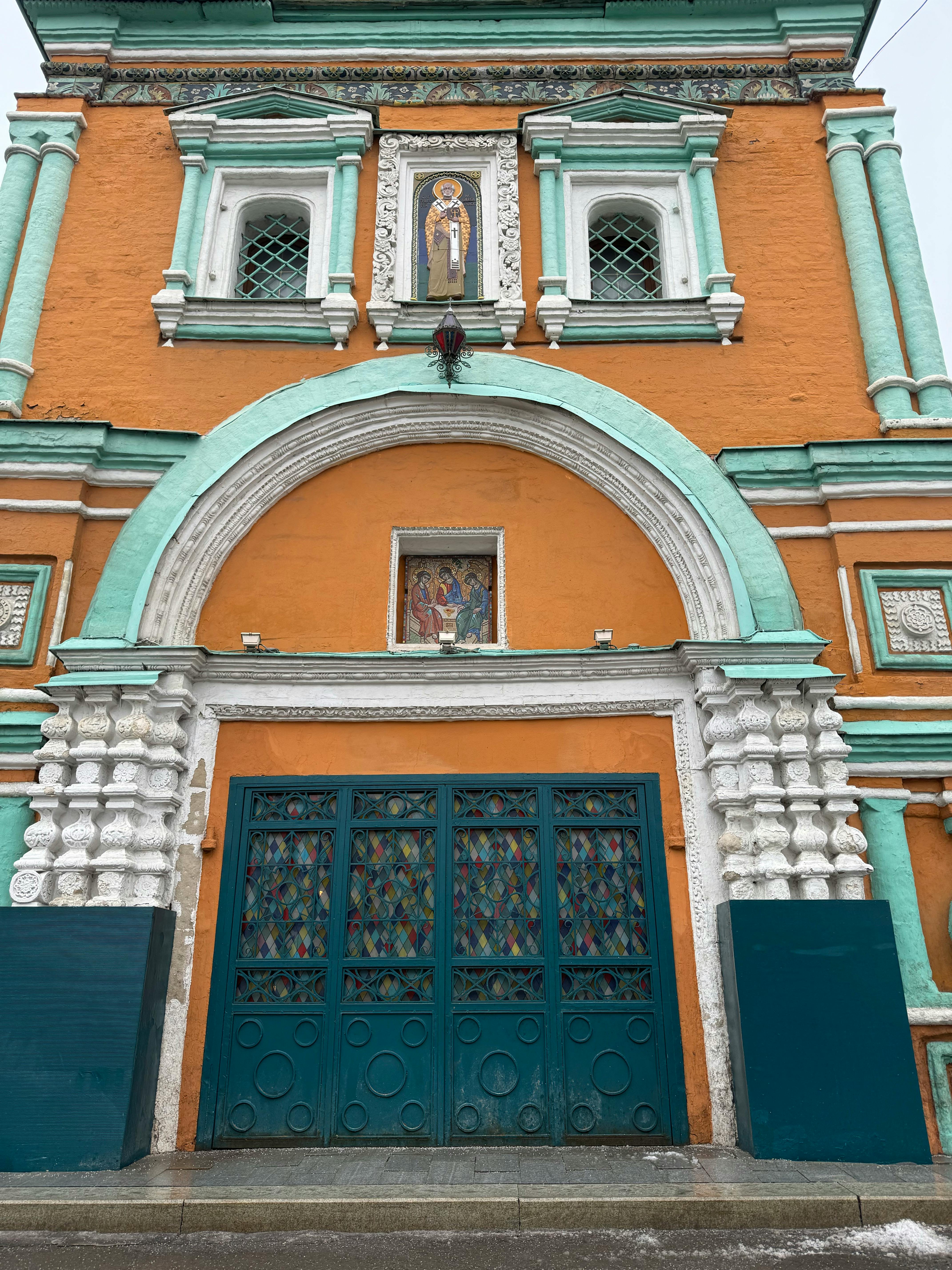 Vibrant Orange and Teal Church Facade · Free Stock Photo