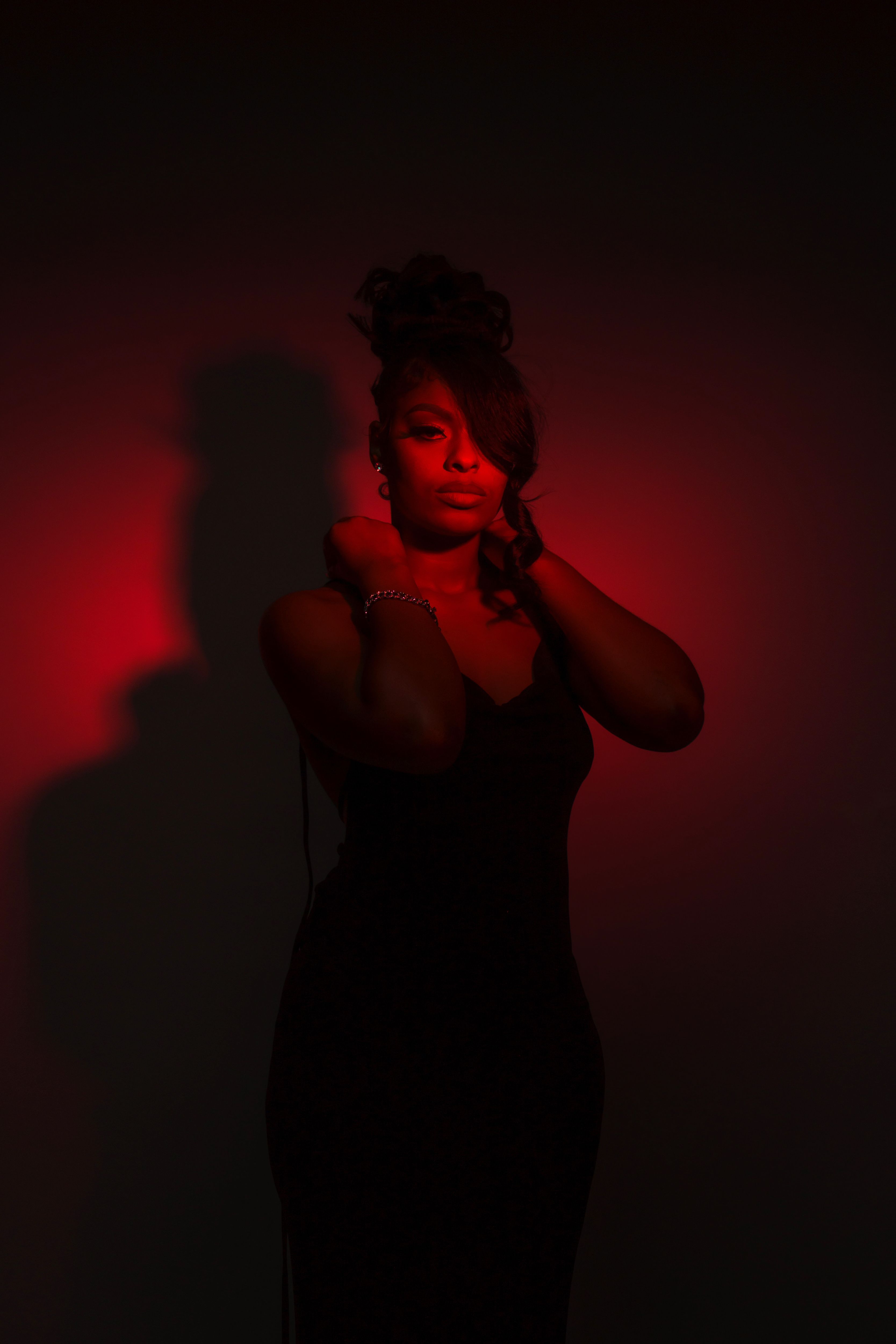 Artistic Portrait with Dramatic Red Lighting · Free Stock Photo