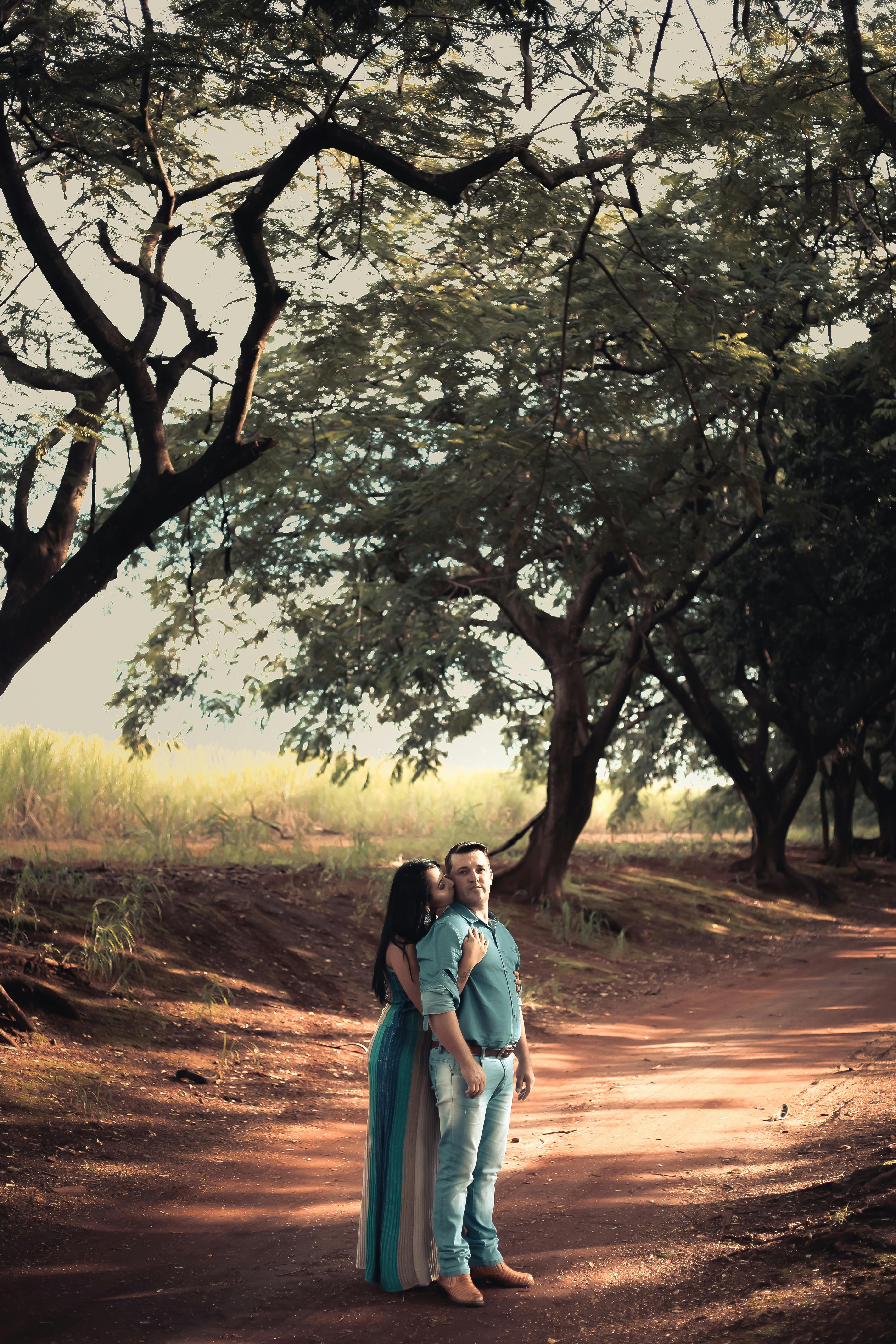 Woman Back Hugging a Man · Free Stock Photo