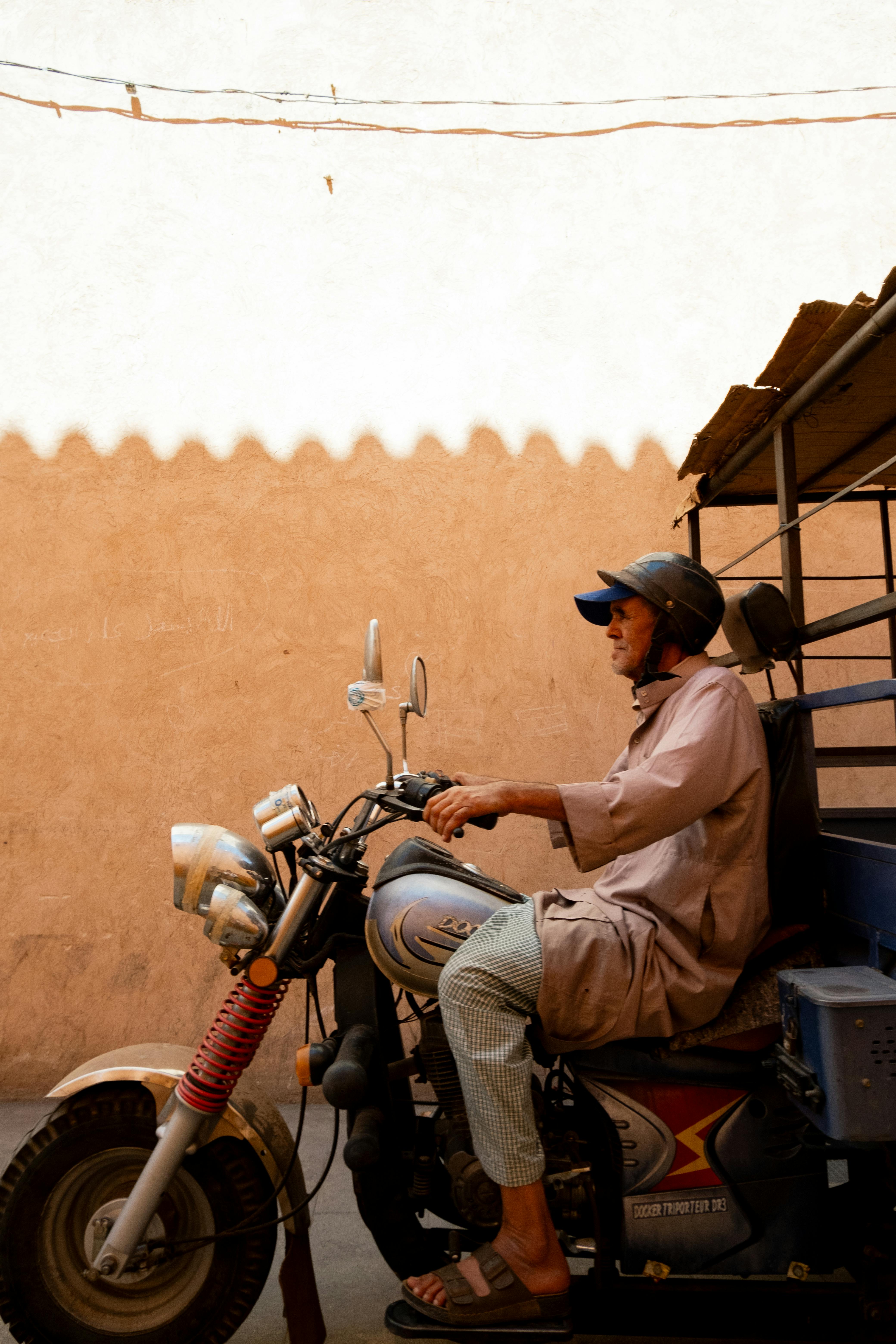 Elderly Man Riding Motorcycle Cargo Trike · Free Stock Photo