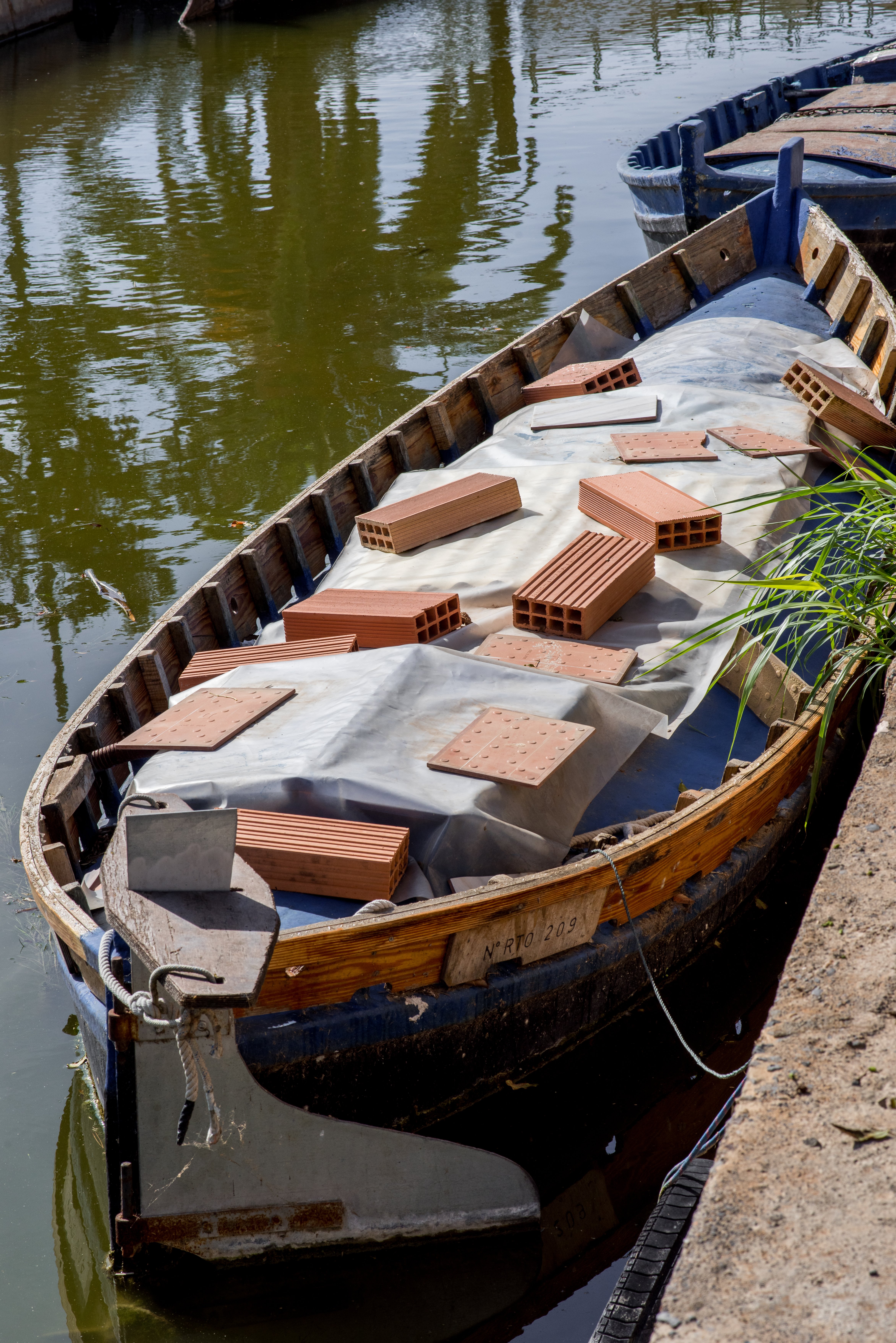Old Wooden Boat Laden with Building Bricks · Free Stock Photo
