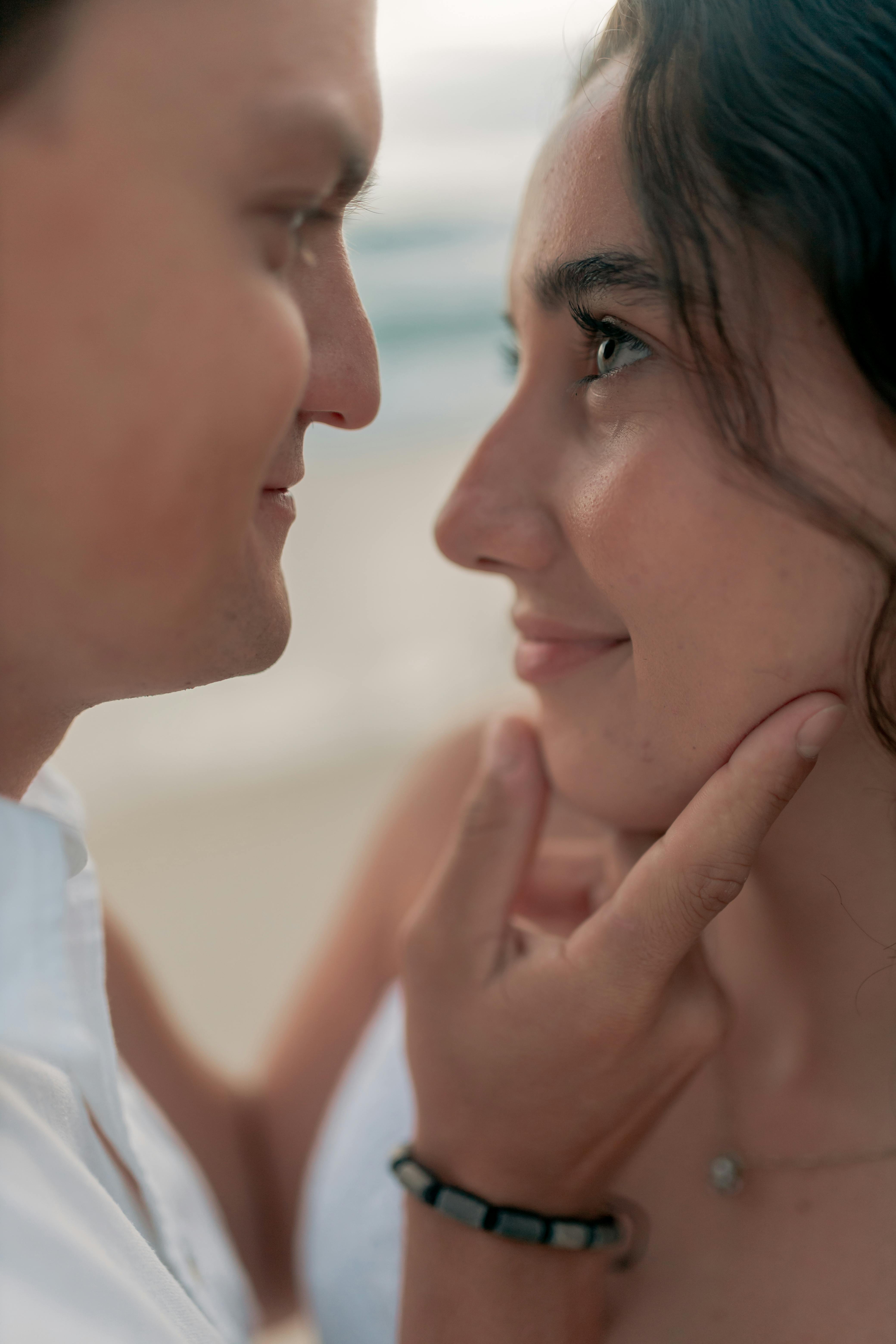 Romantic Close-Up of a Couple Gazing Lovingly · Free Stock Photo